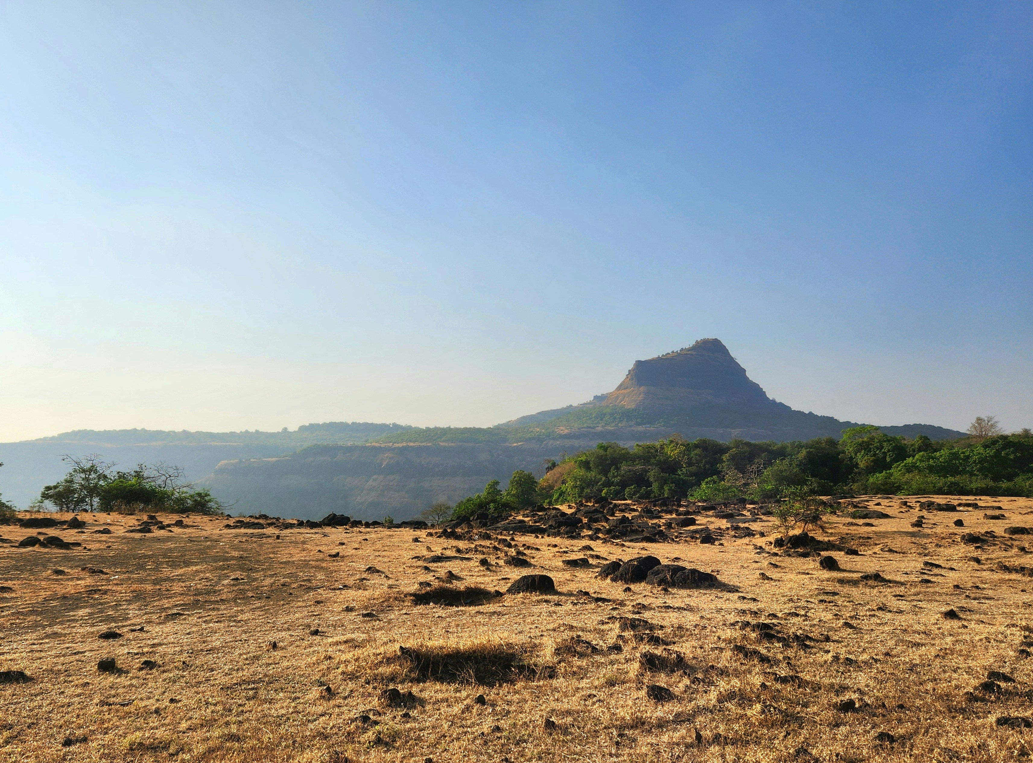 Cone of Serenity: A Lone Mesa Rising Over Dried Plain