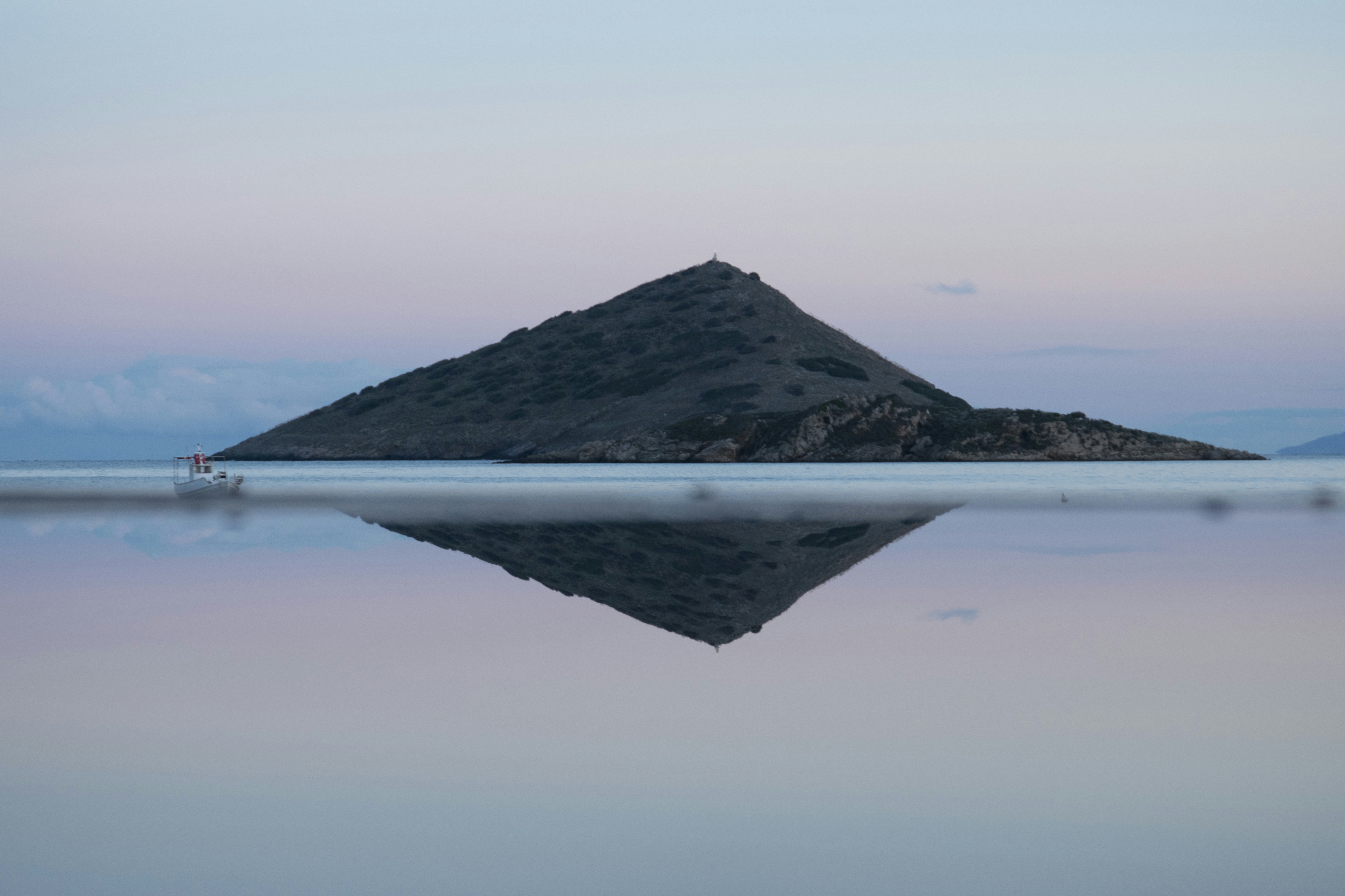 Dawn's Quiet Symmetry: The Isle and Its Mirror