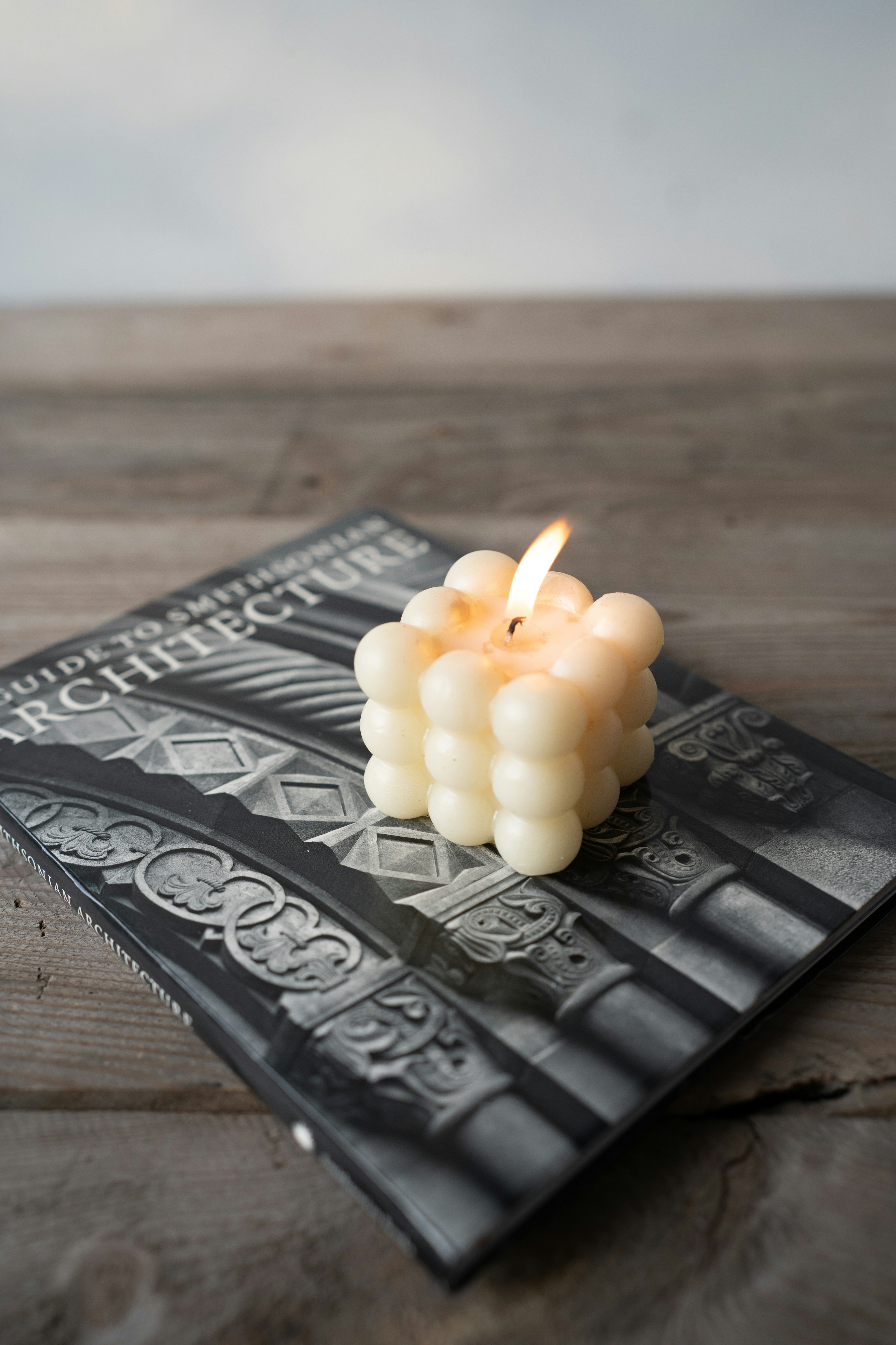 Candlelit Book: A Quiet Moment on a Wooden Stage