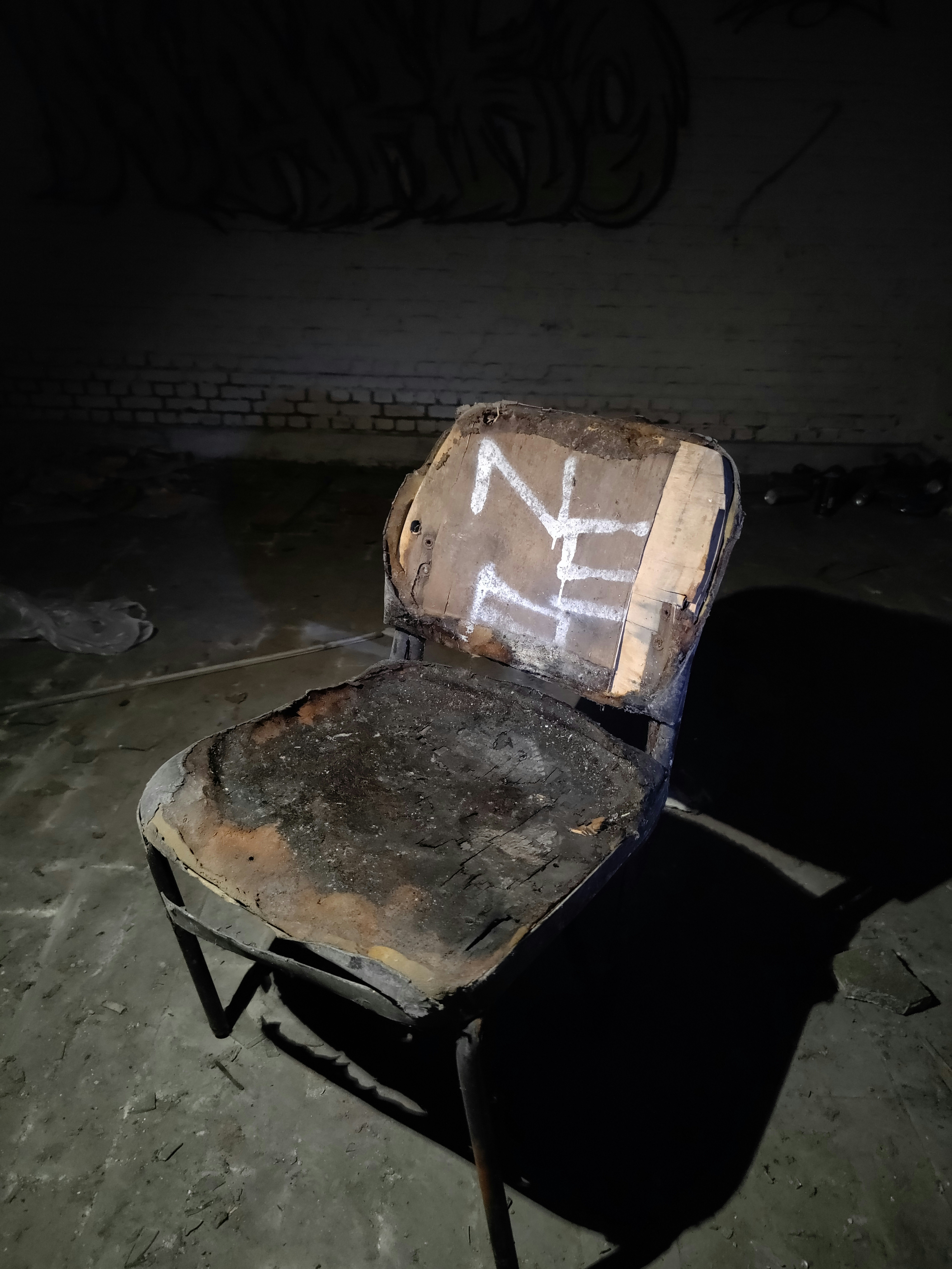 Charred Classroom Stool in an Abandoned Space