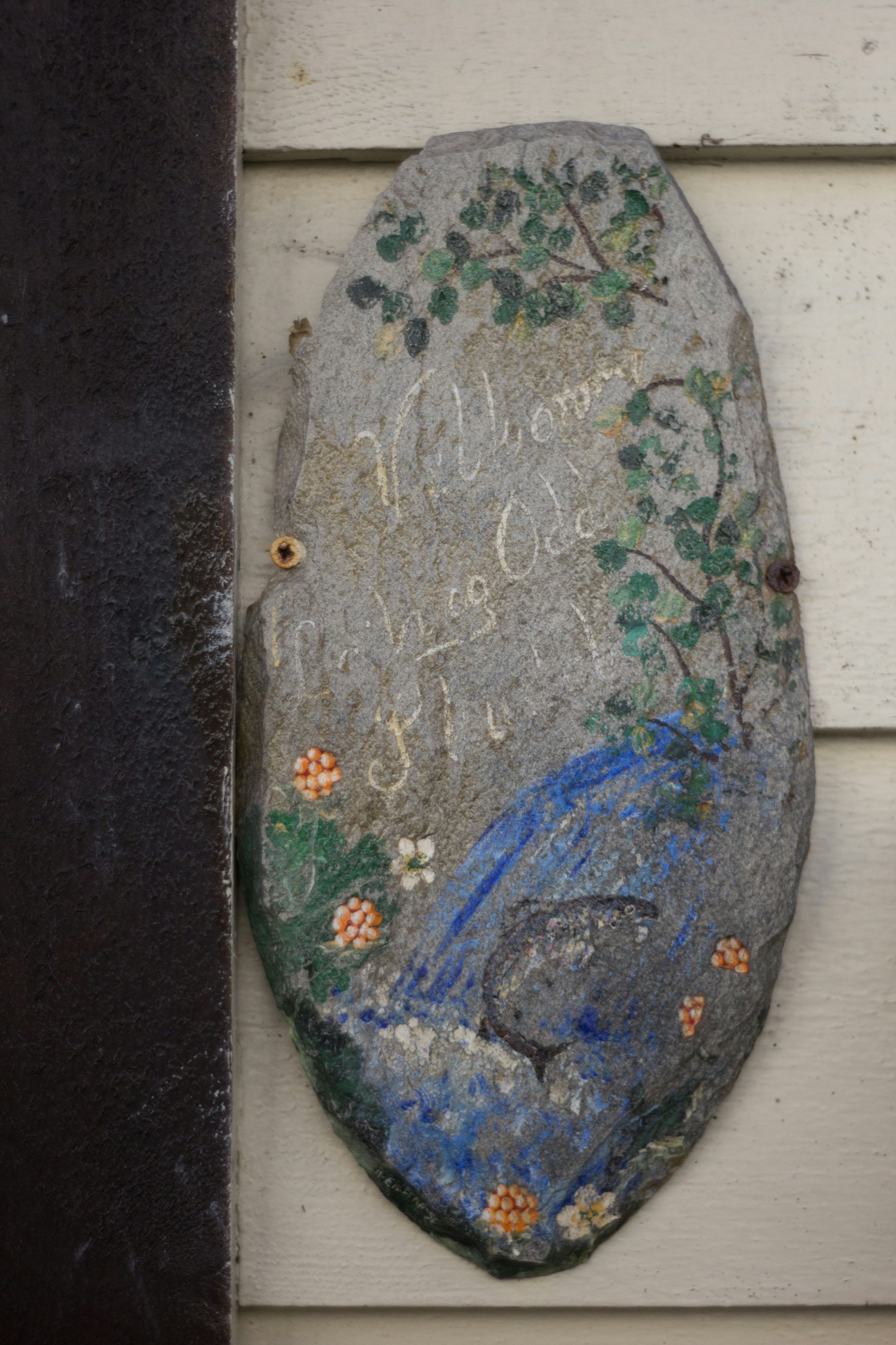Painted Stone Memorial Adorning the Wall