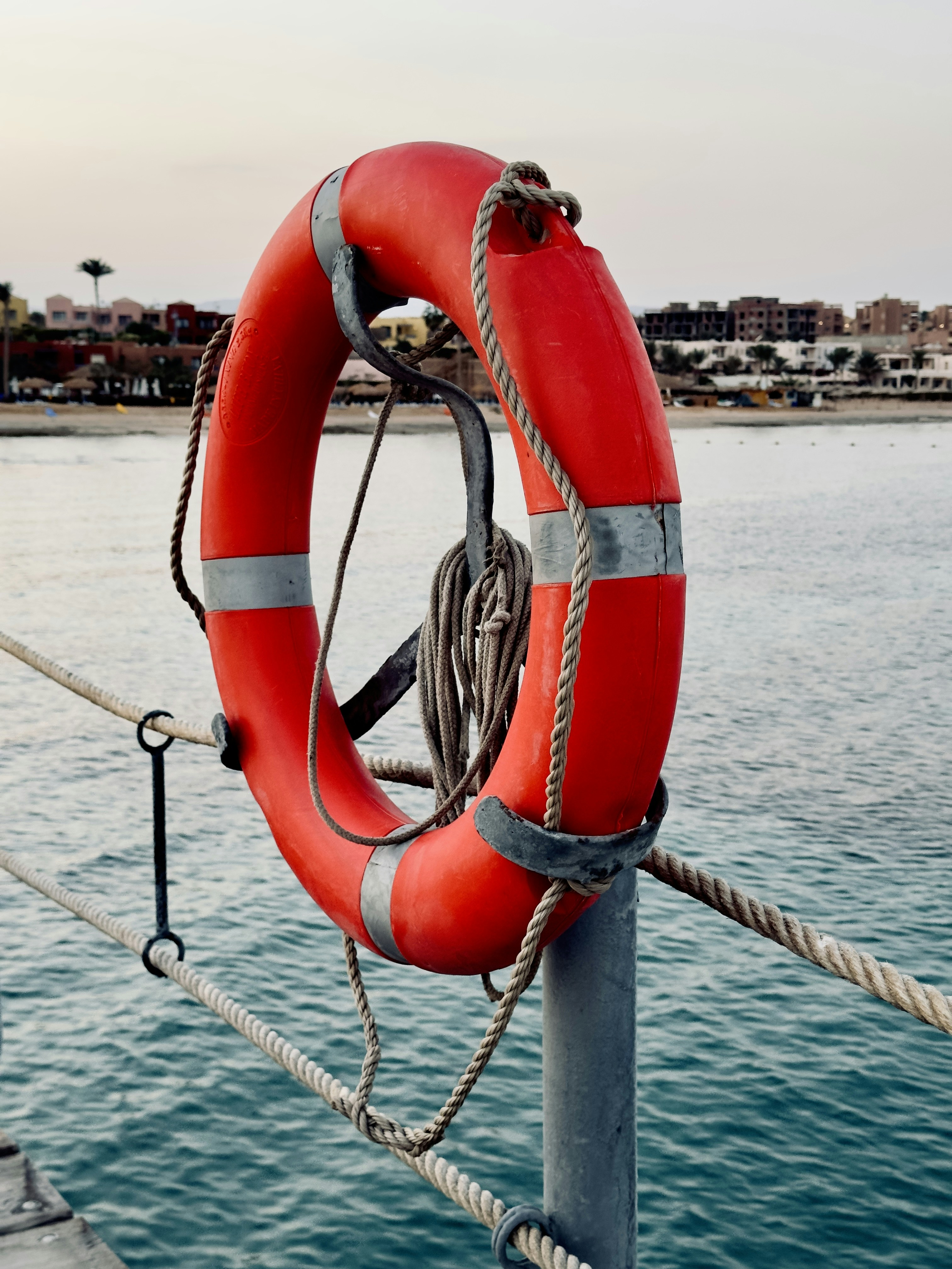 A life preserver on a boat in the water photo – Free Lifesaver Image on ...