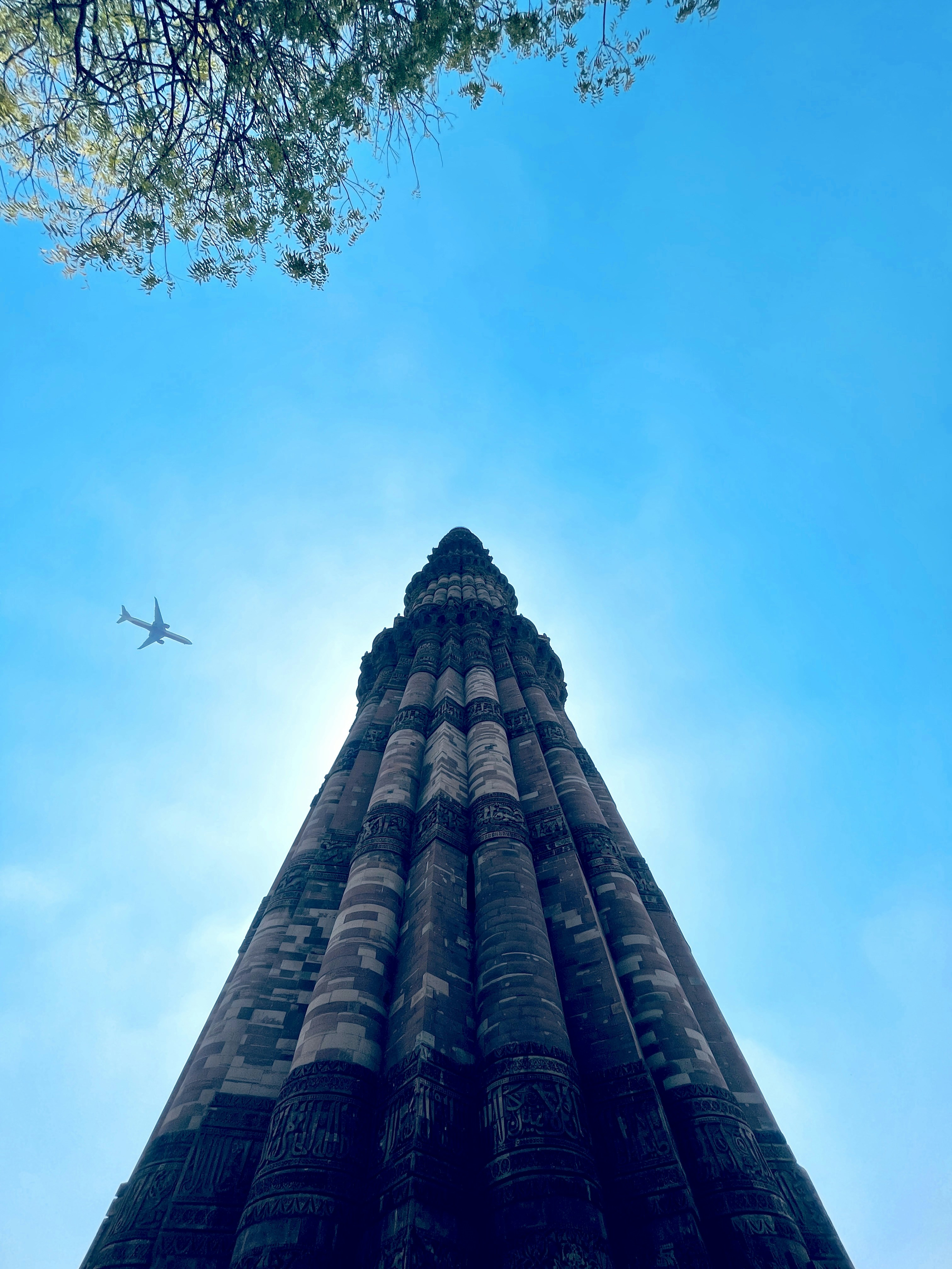 Skyward Carving: A Temple Spire Reaching Into Cerulean Air