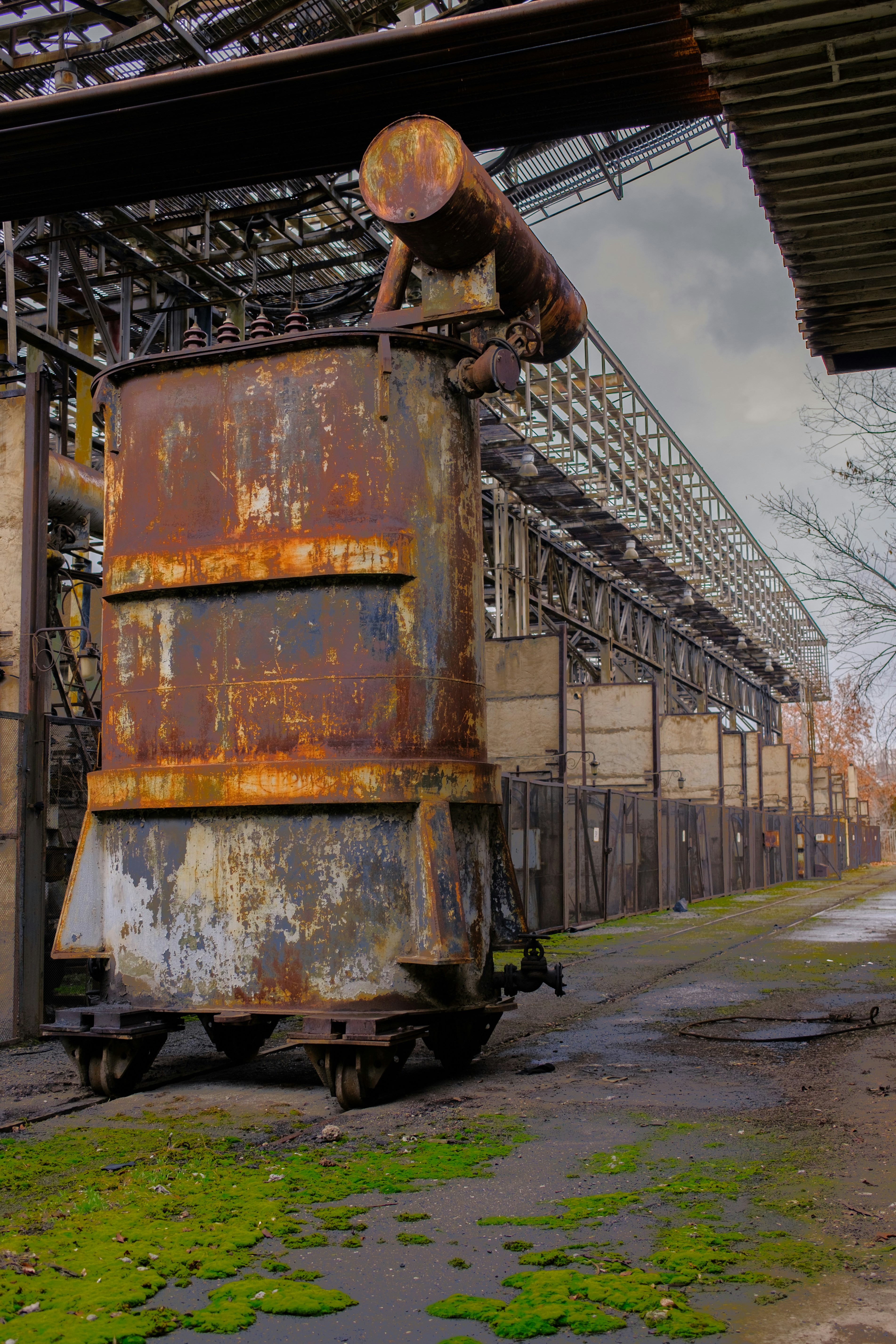 Rusted Behemoth on Rails: An Industrial Relic Beneath a Lattice Sky