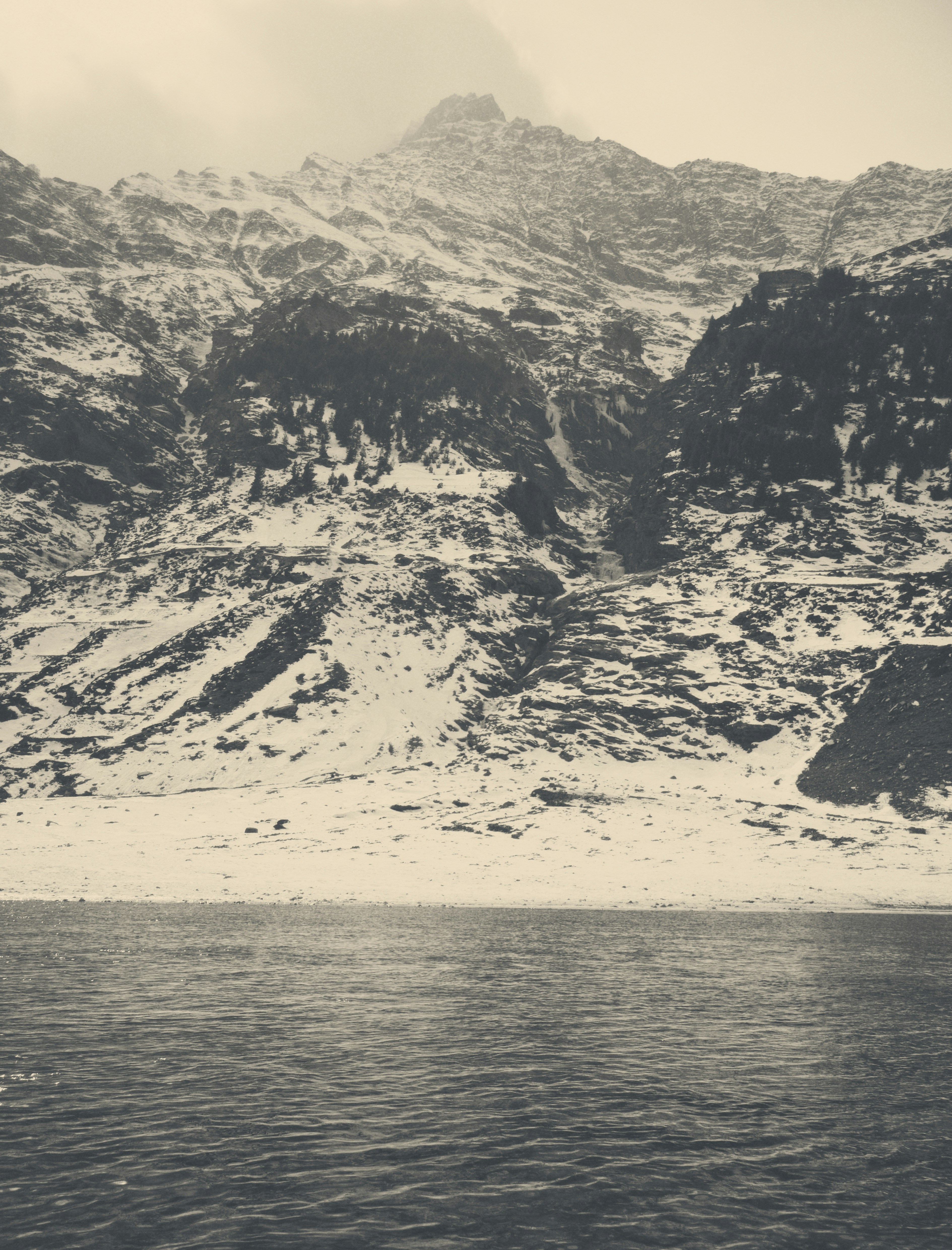 Snow-etched Fjord: Quiet Boundary Between Mountains and Sea