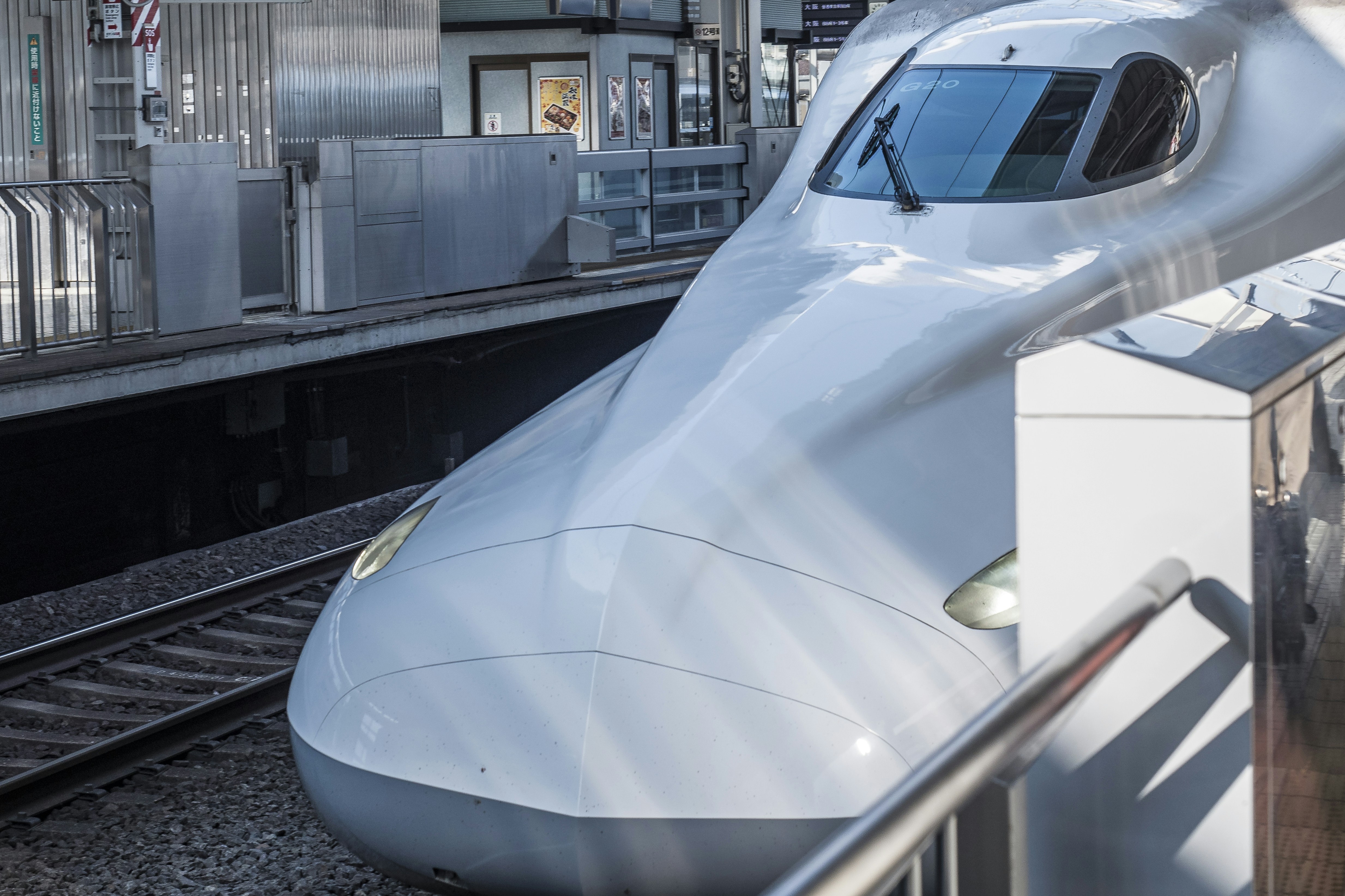 A white bullet train parked at a train station photo – Free Japan Image ...