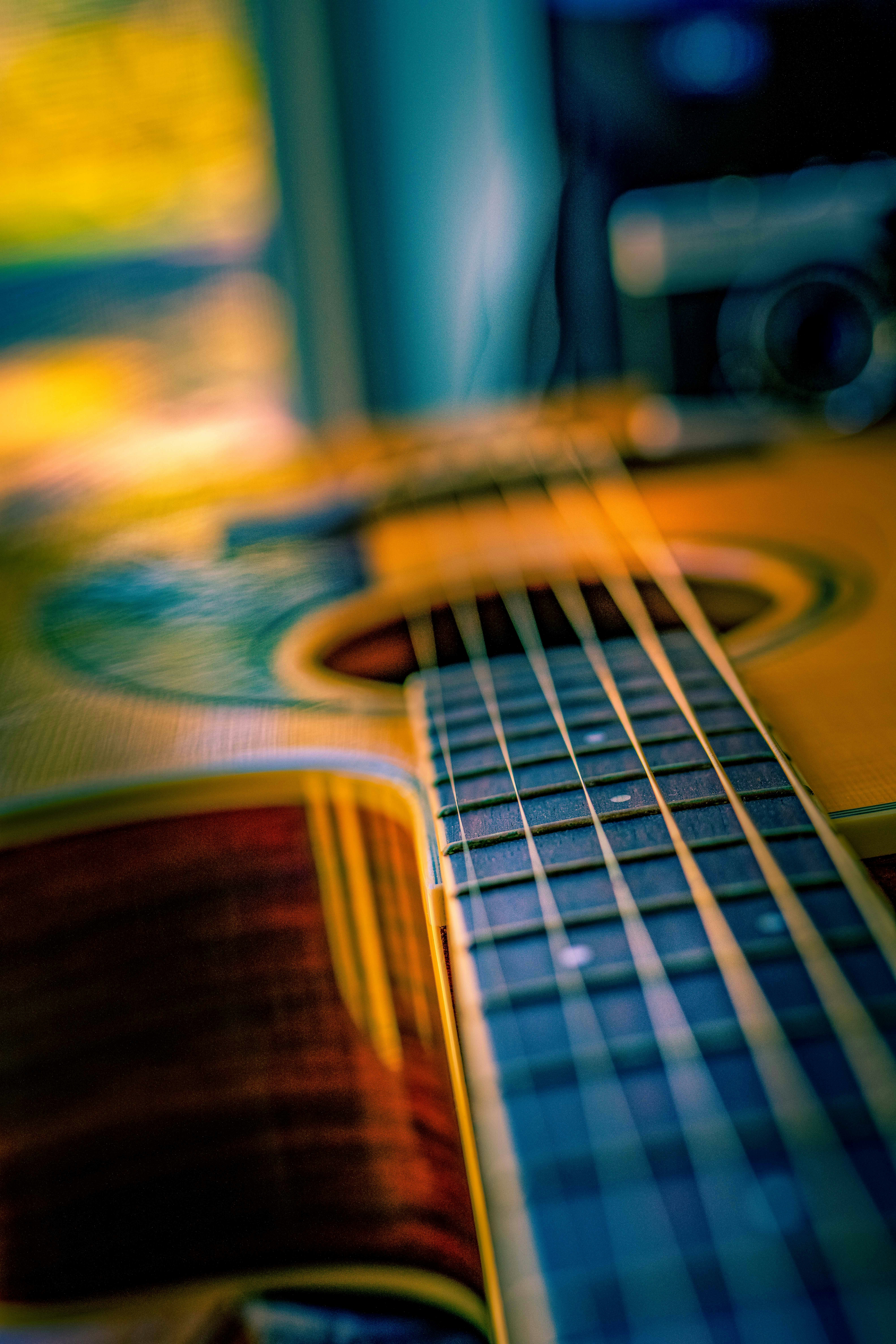 A close up of a guitar with a blurry background photo – Free Guitar ...
