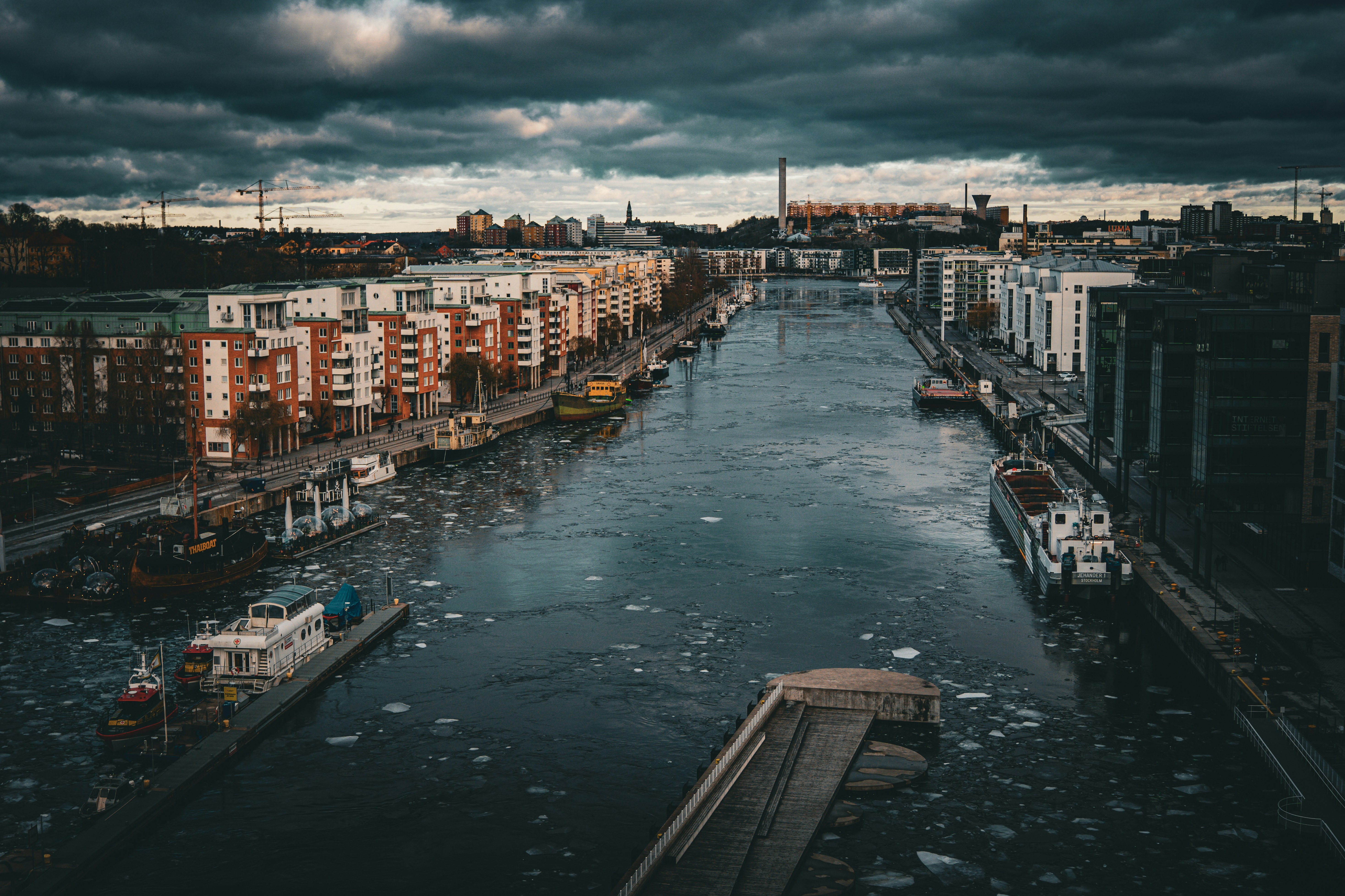 A Channel Through the City: Boats, Bridges, and Evening Clouds