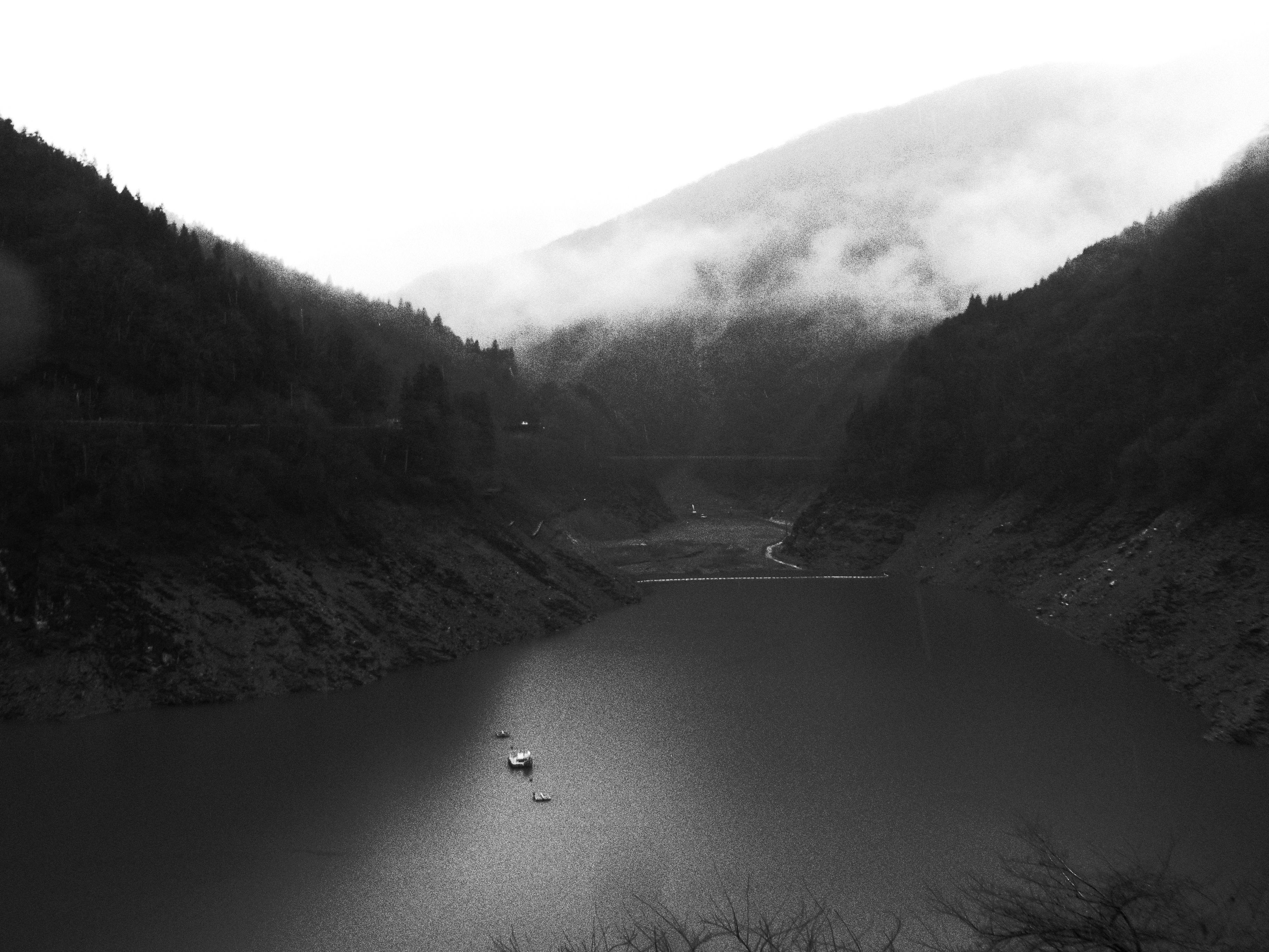 Mist-Threaded Valleys: Quiet Boats on a Mountain Reservoir