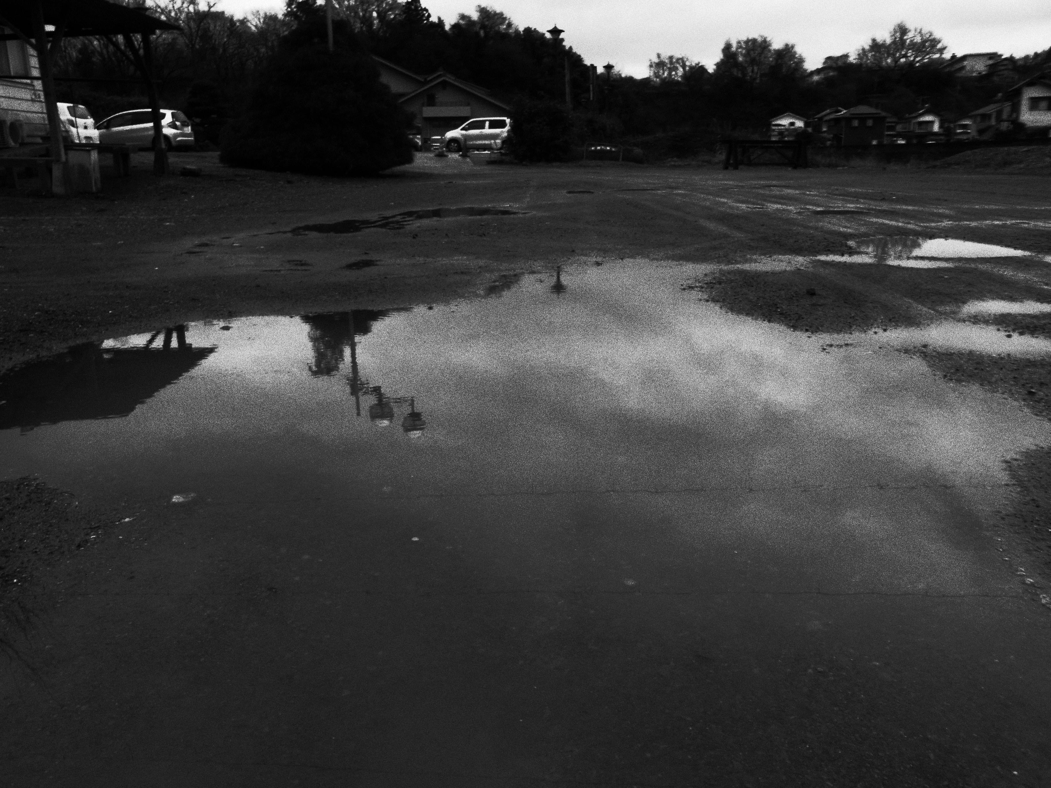 A black and white photo of a puddle of water photo – Free Water Image ...