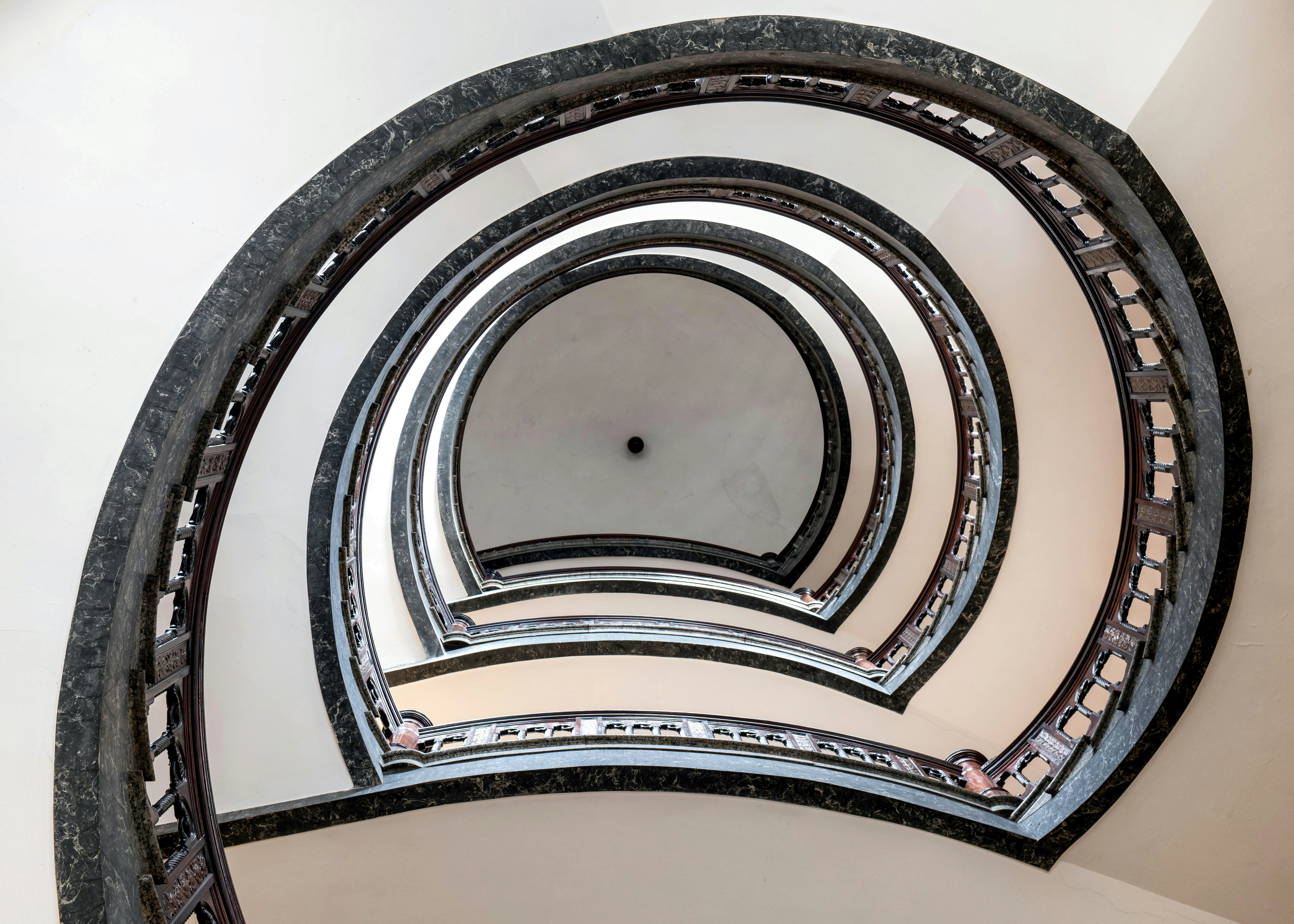A circular mirror reflecting the inside of a building photo – Free ...