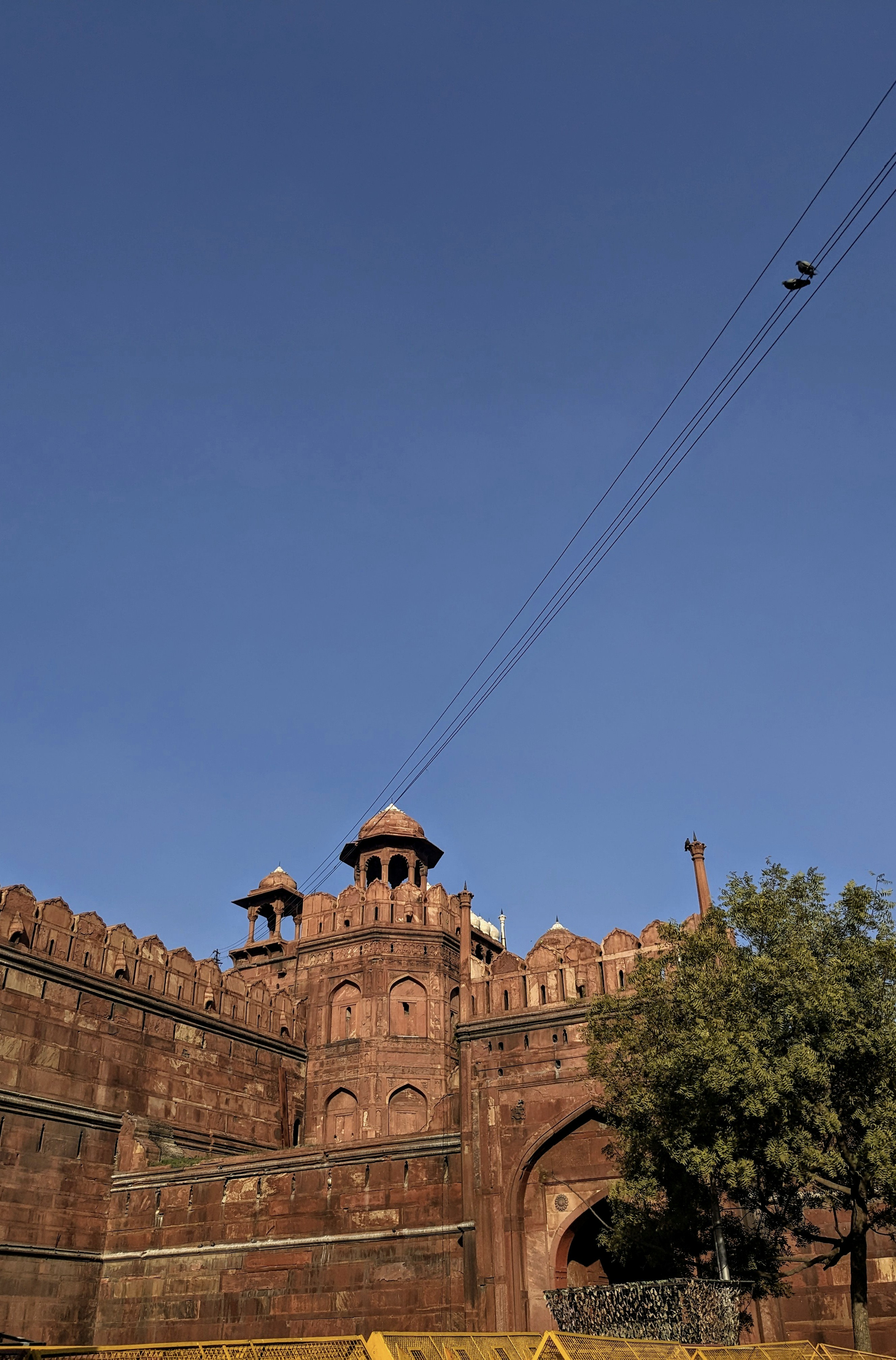 Crimson Bastion under a Clear Blue Sky