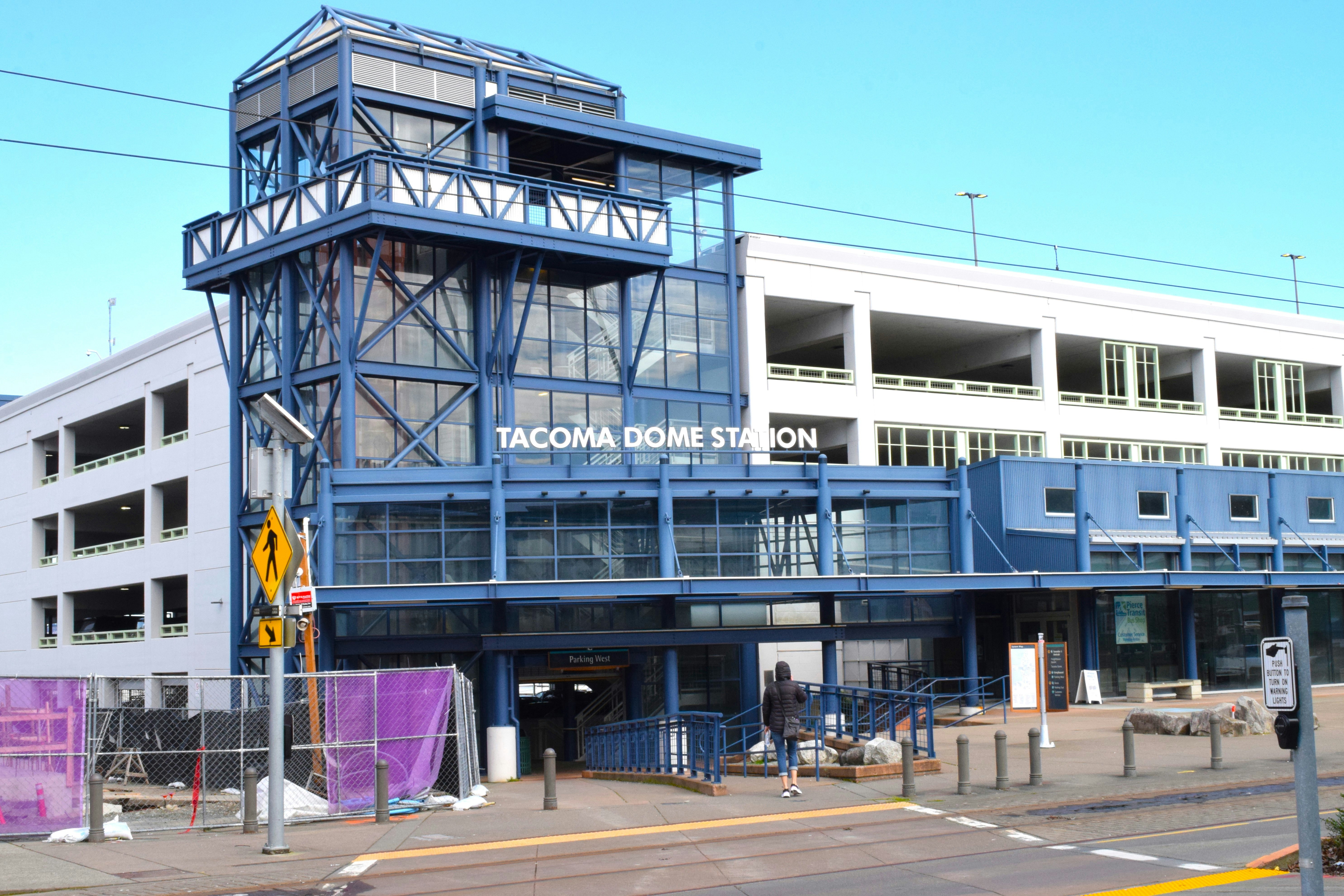A blue and white building sitting on the side of a road photo – Free ...