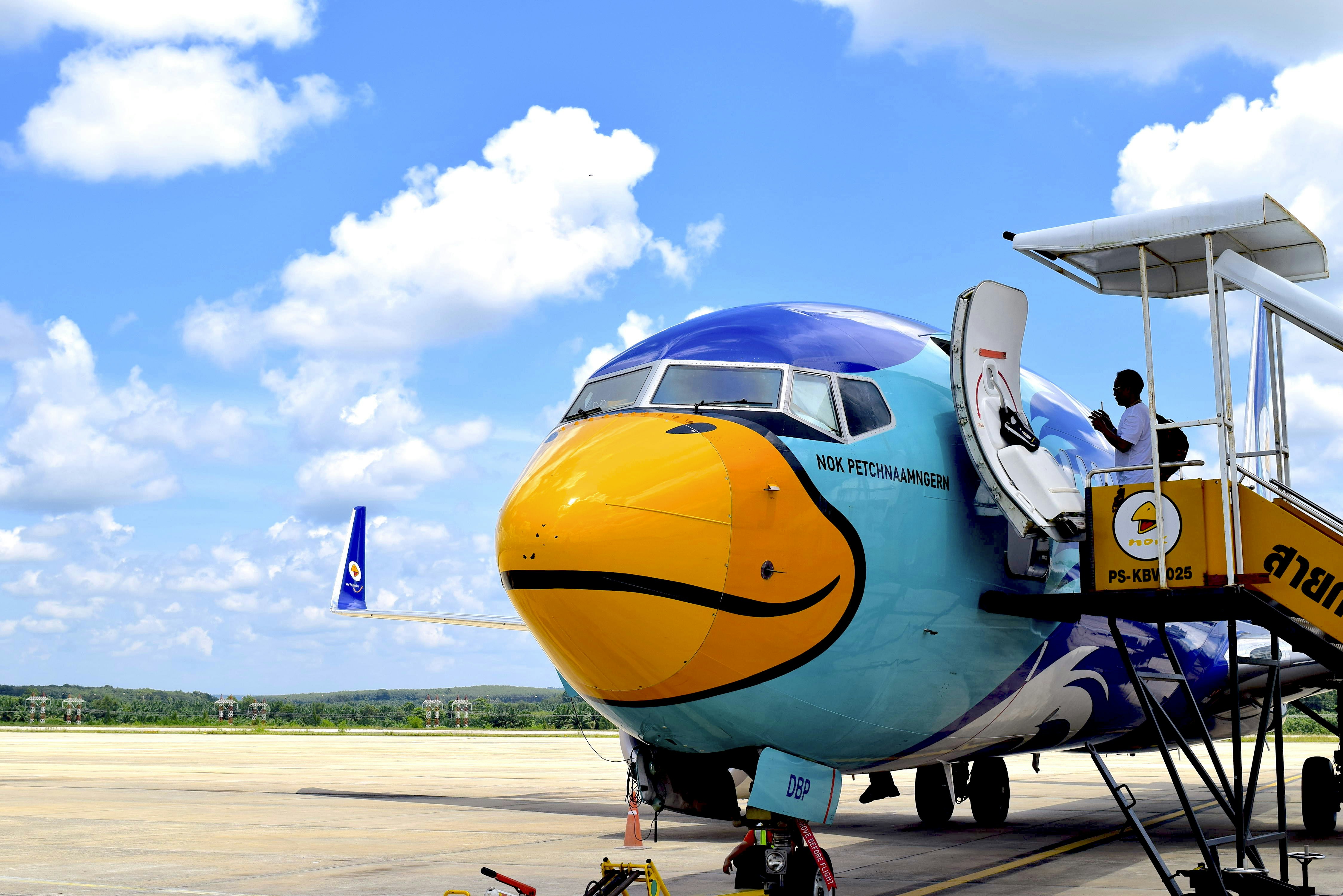 An airplane with a smiley face painted on the side photo – Free Krabi ...