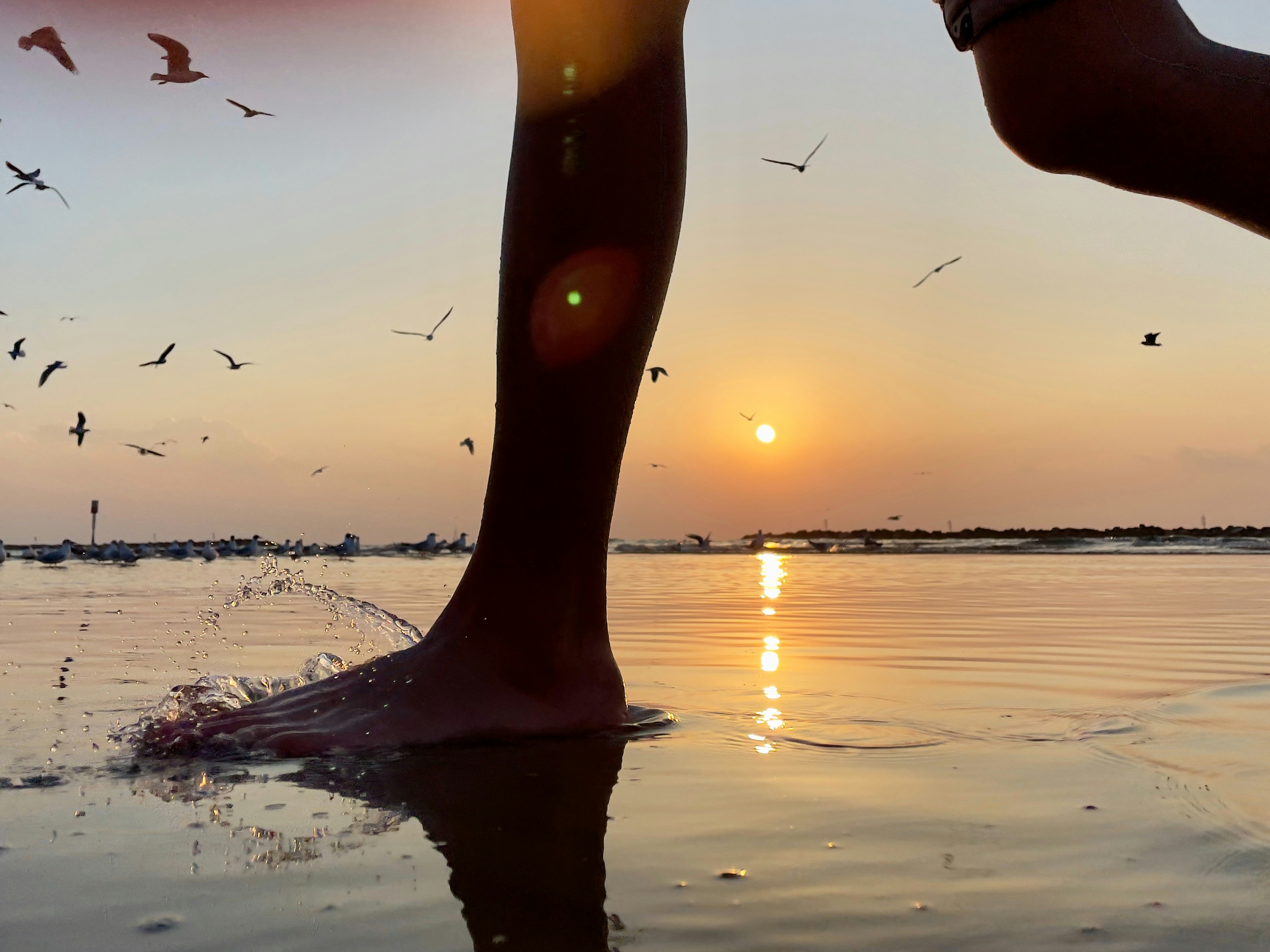 Sunset Sprint: Bare Feet Skimming a Glassy Tide