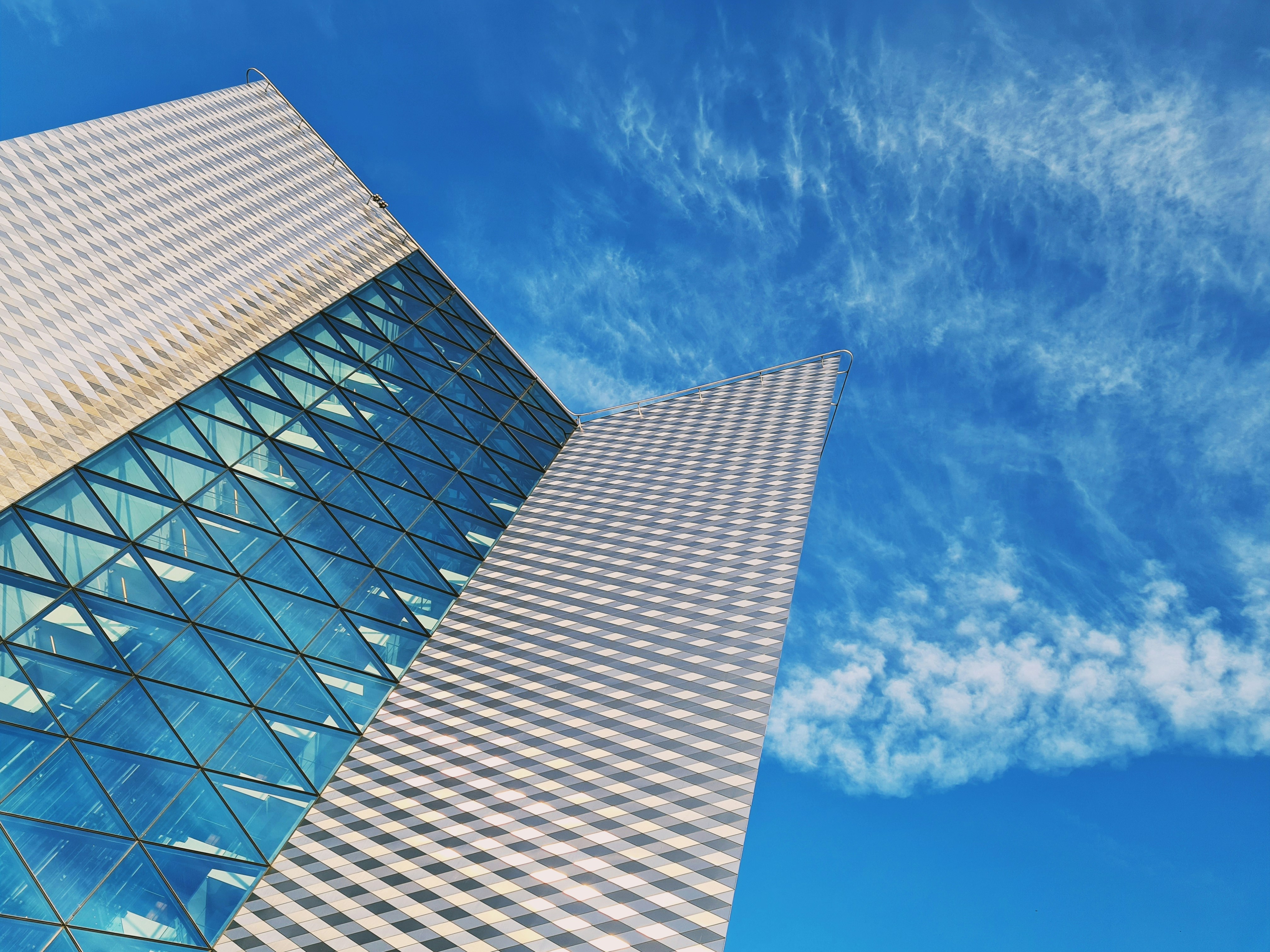 A very tall building with a lot of windows photo – Free City Image on ...