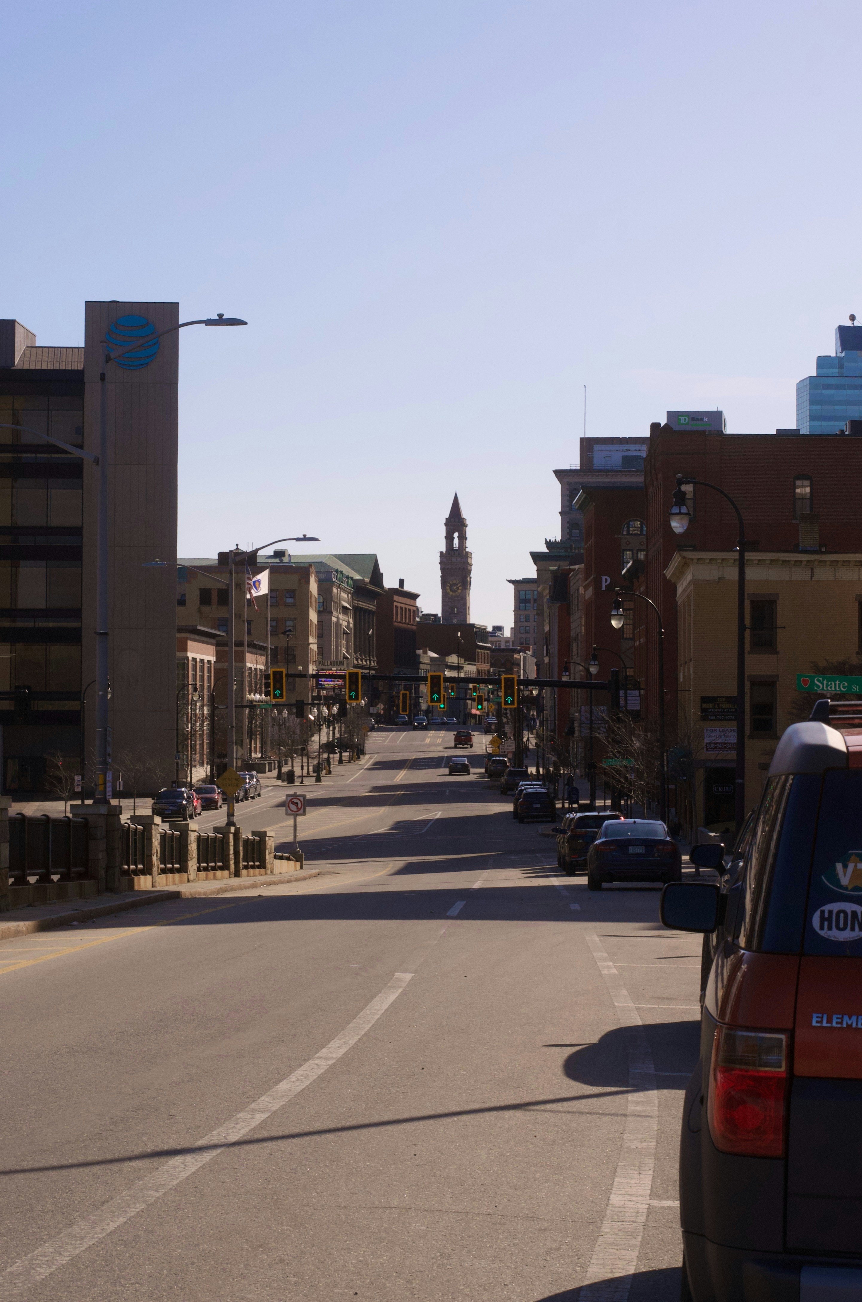City Street Aims Toward a Clocktower Horizon