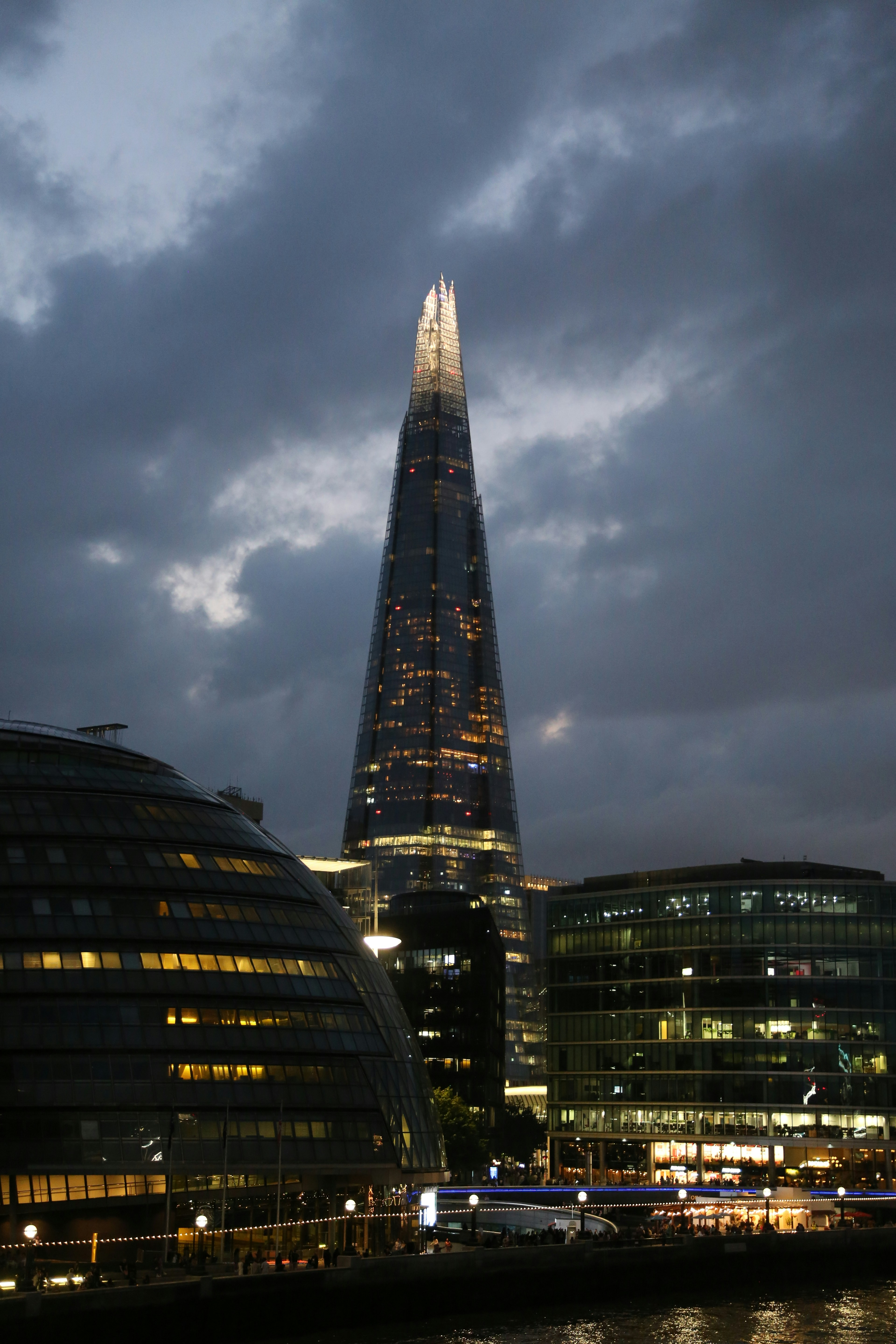 The shard of the building is lit up at night photo – Free London Image ...