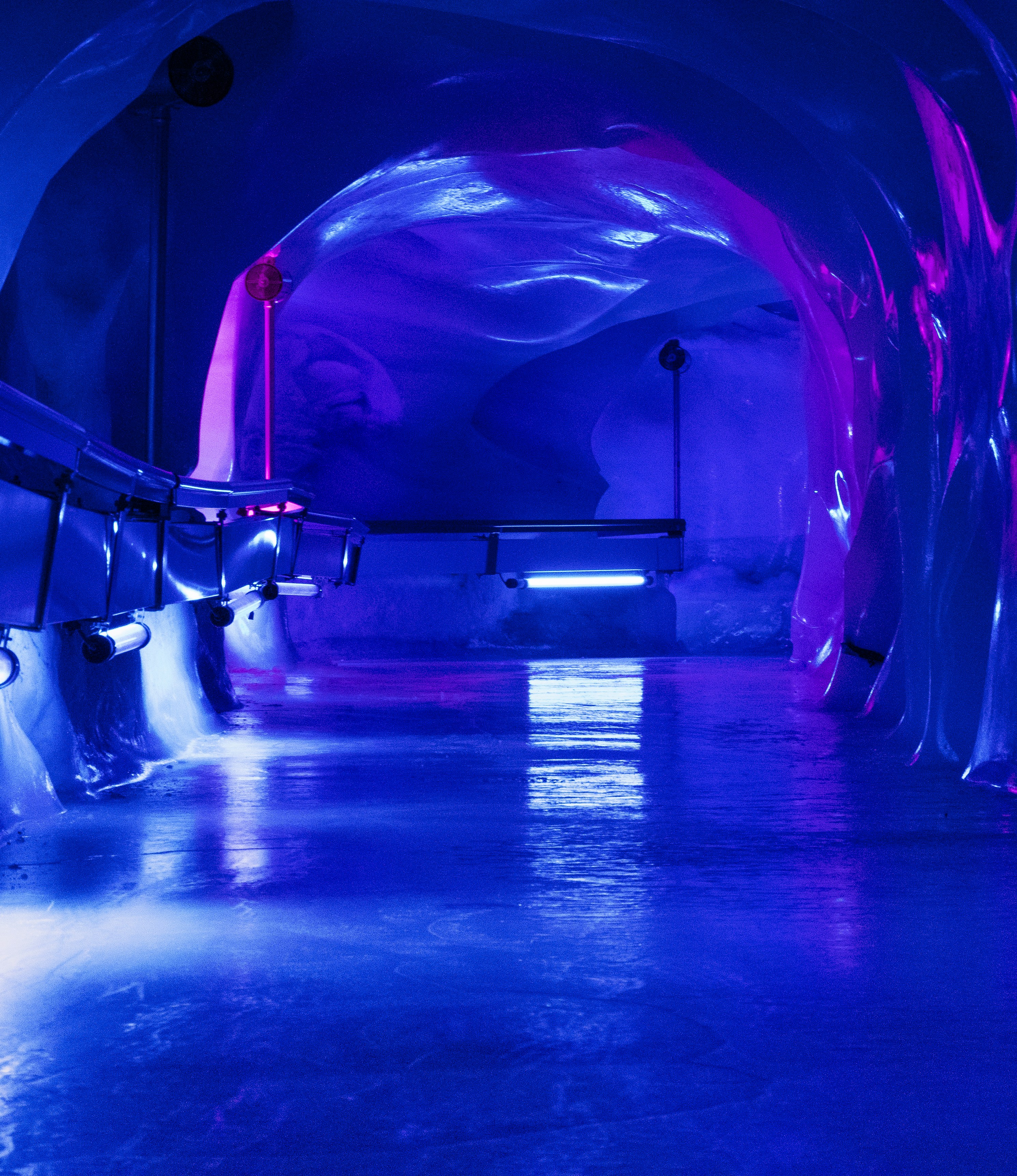 Glow-Tuned Tunnel: Neon-lit Ice Corridor