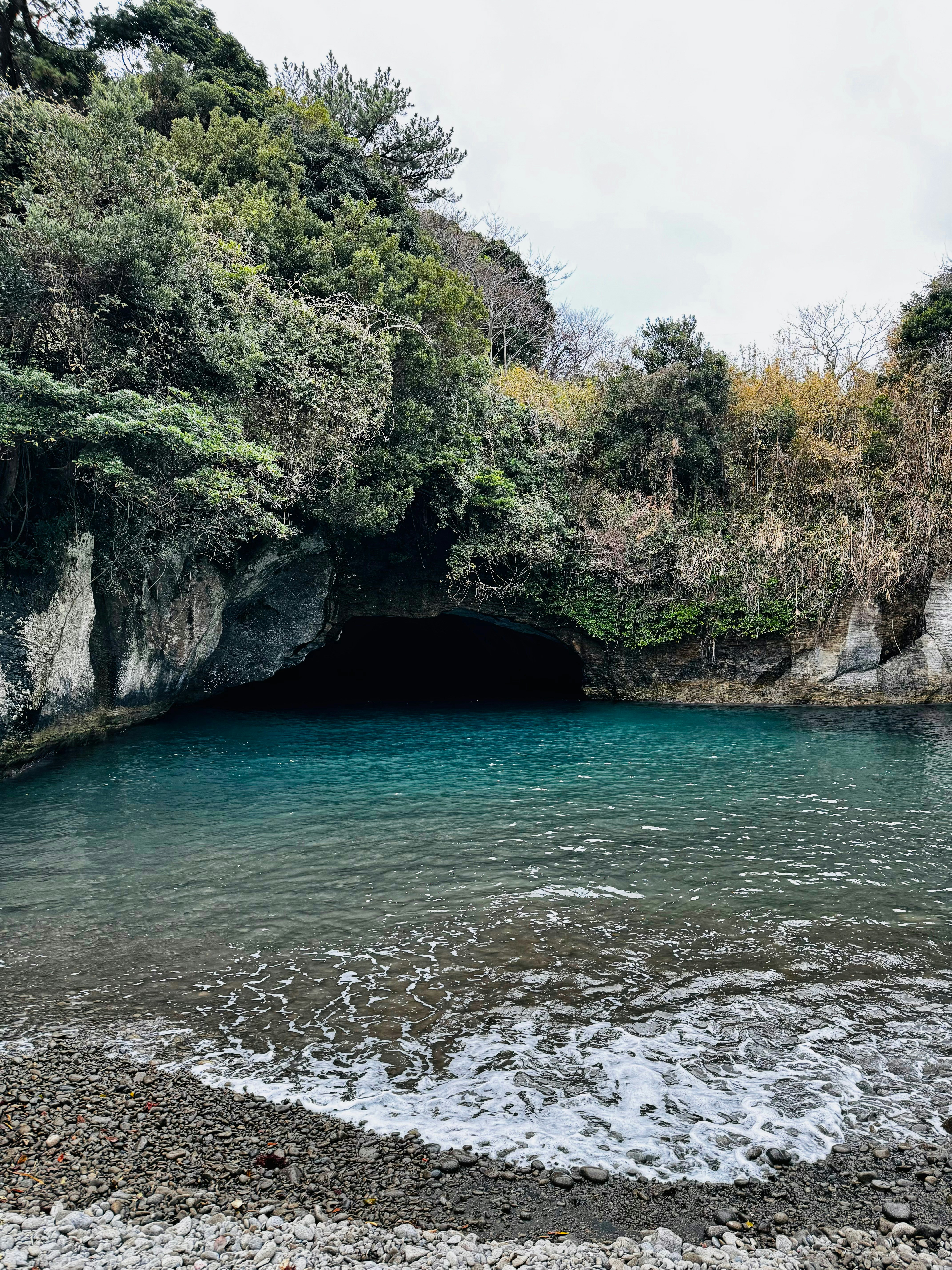 Turquoise Cove Gate: Cliffside Cave Opening Faces the Quiet Sea