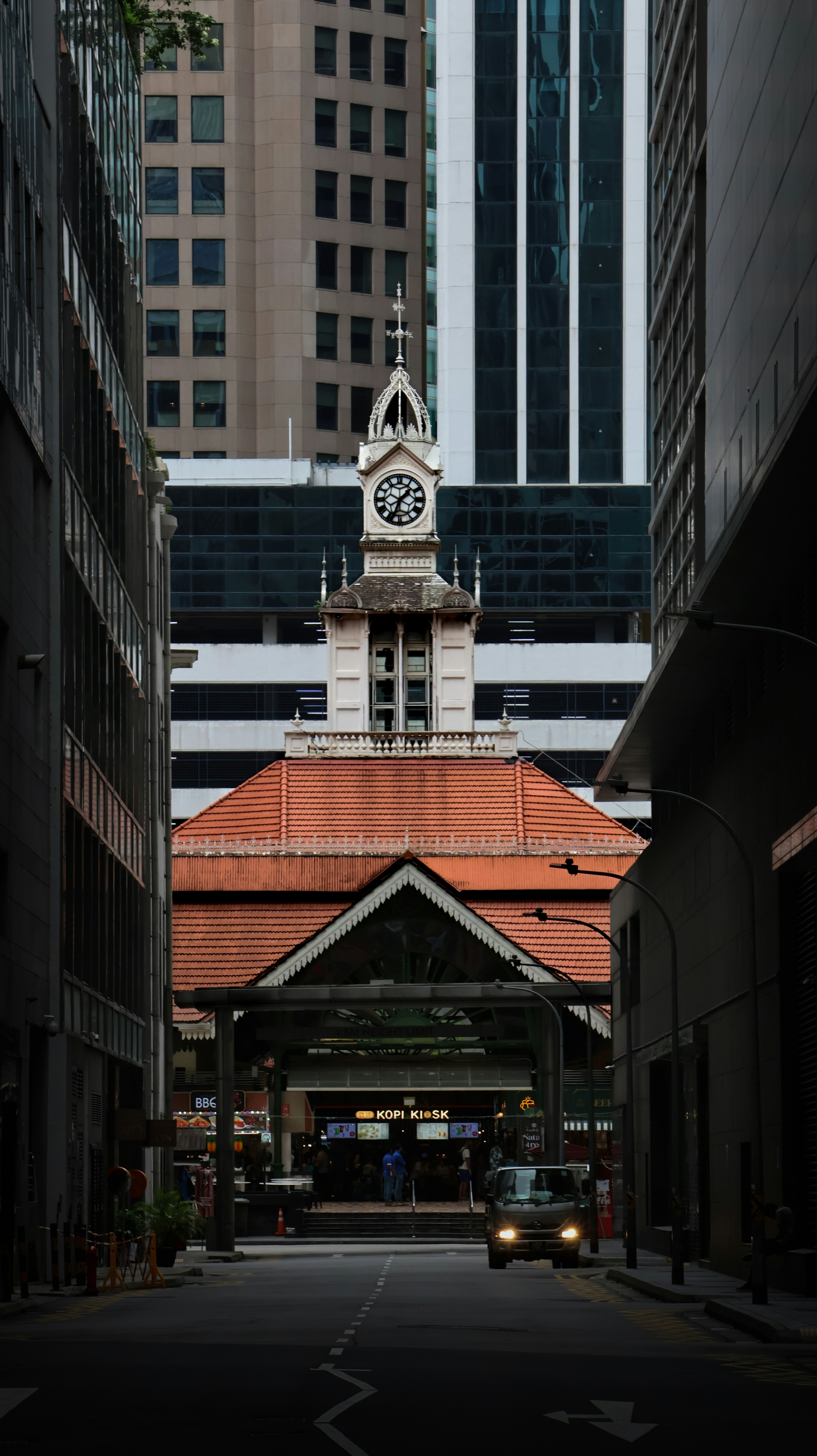 Clocktower in the City Canyon: A Historic Pulse Between Skyscrapers