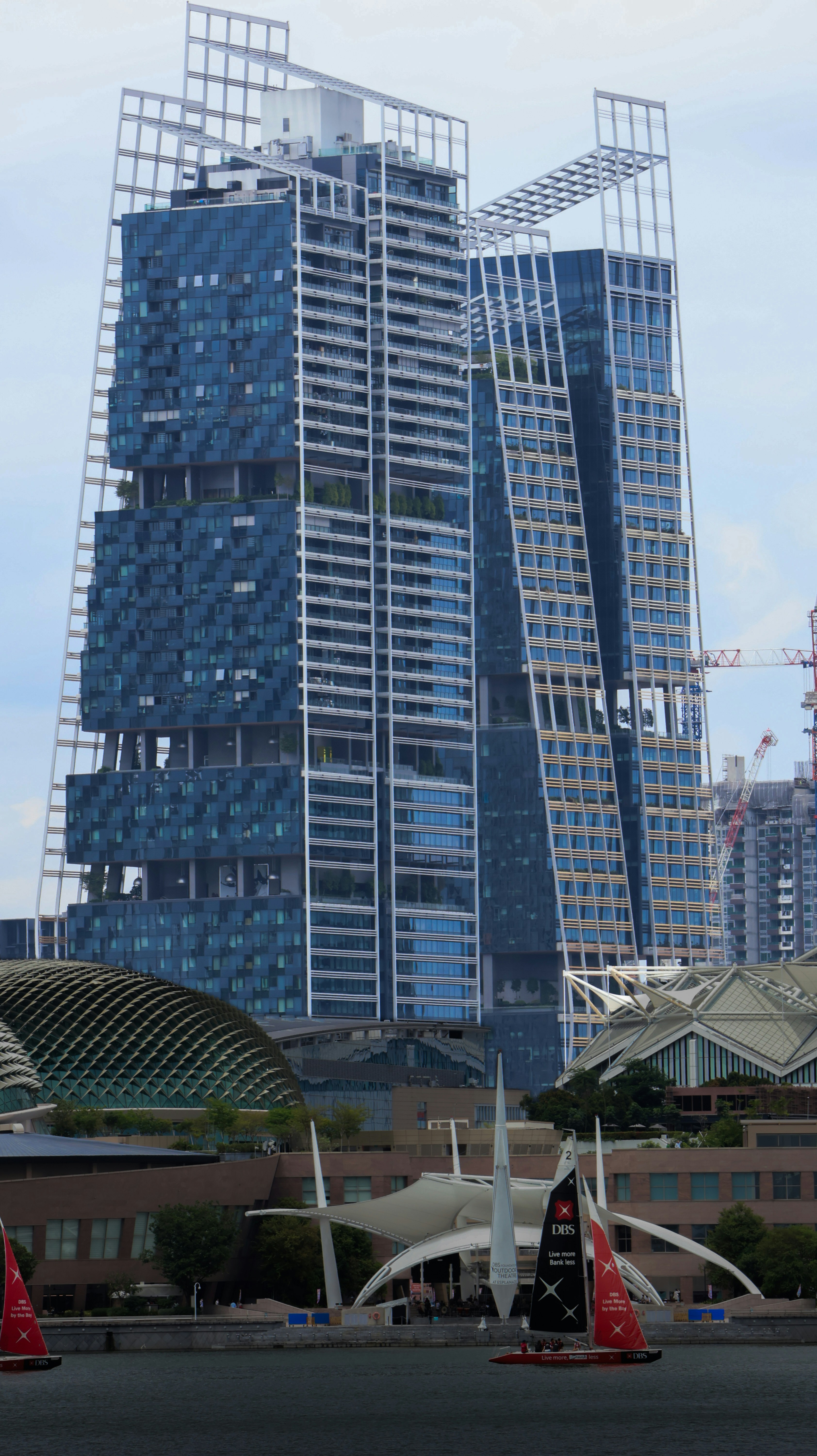 Harbor Glass Ascendant: A Blue-Tinted Tower with Mesh-Like Skyward Framework