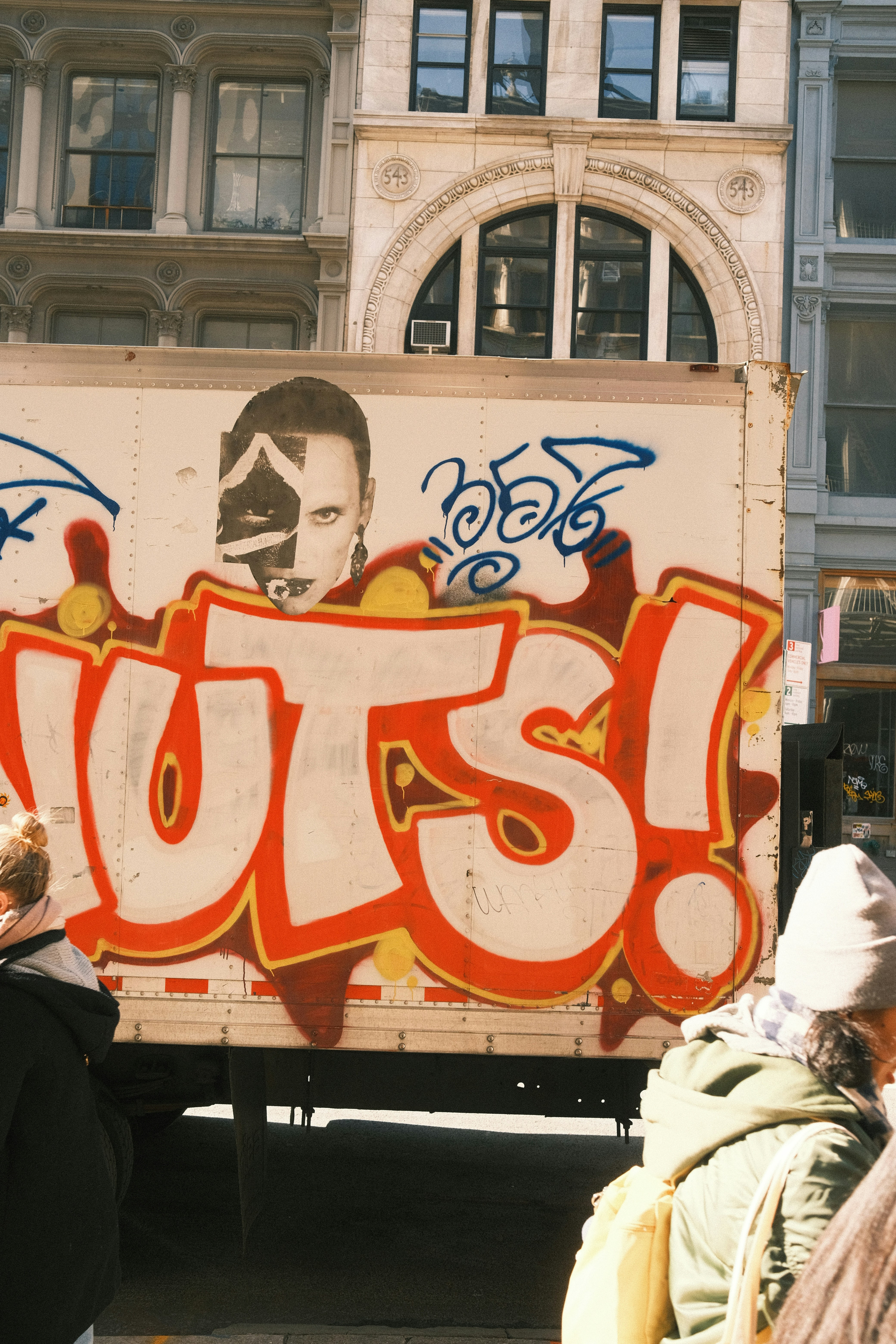 a truck with graffiti on the side of it