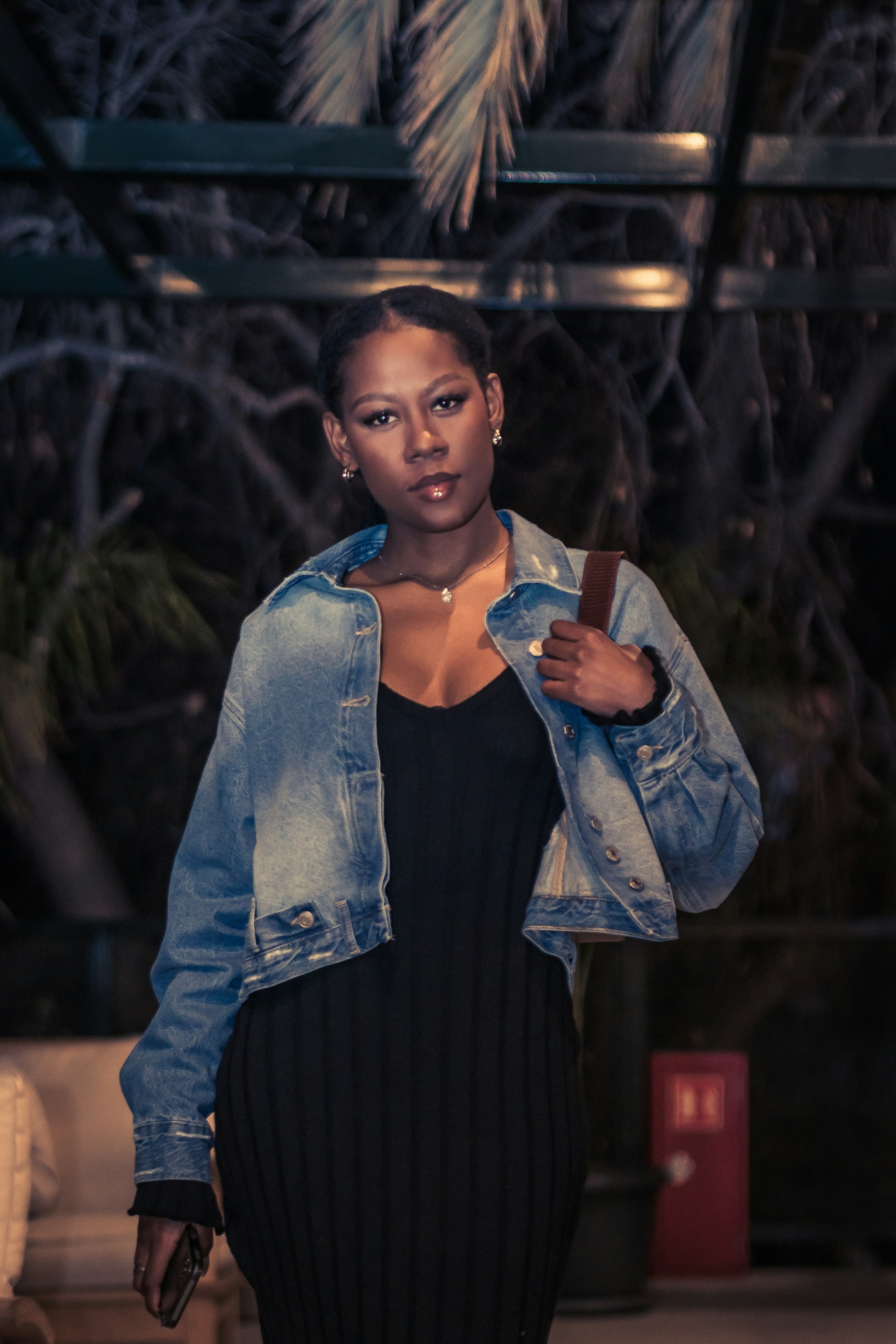 Midnight Denim: Poised Portrait Under Warm Night Lighting