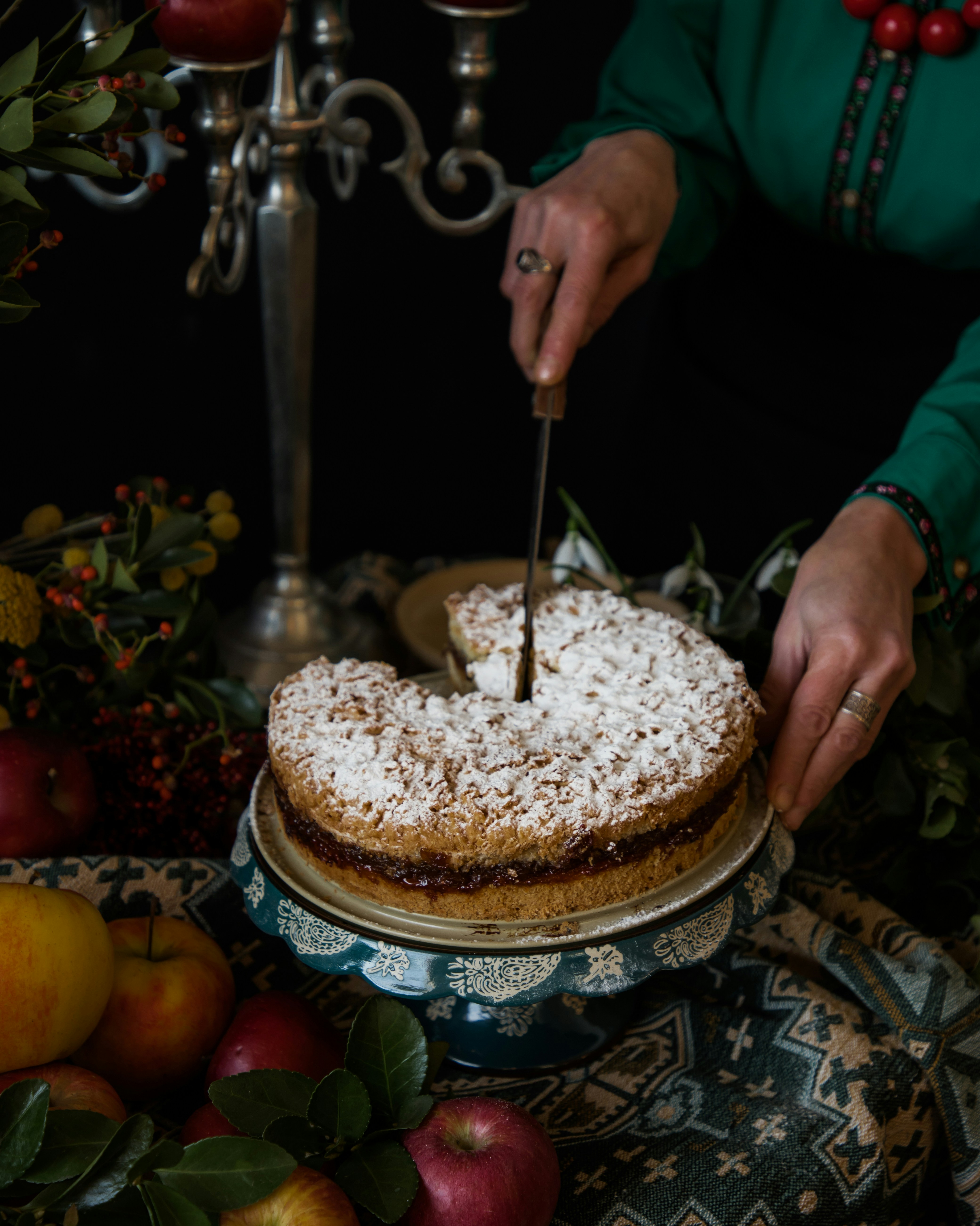 Hands, Knife, and Powdered Cake: A Quiet Moment of Craftsmanship