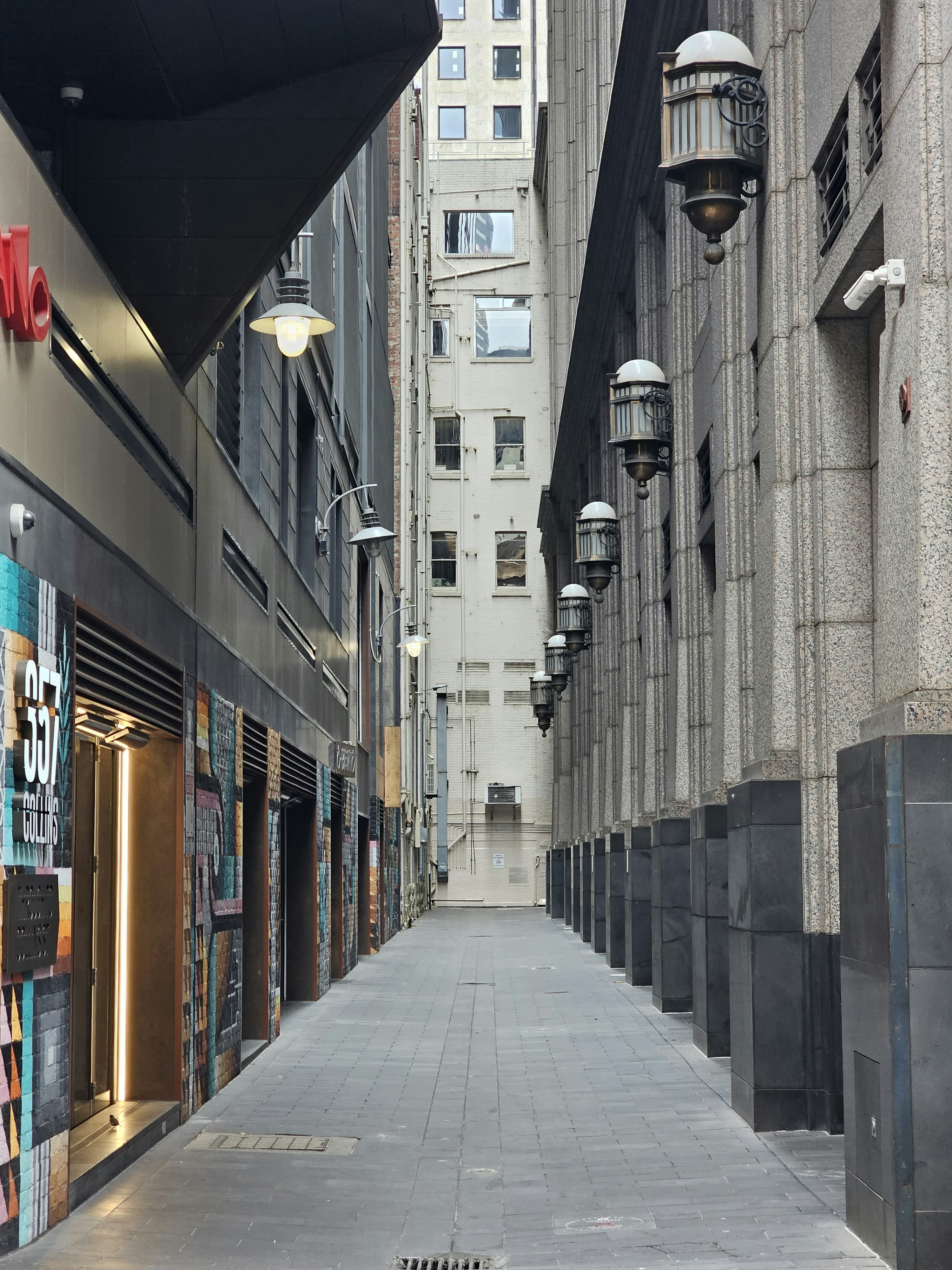 A city street with a row of tall buildings photo – Free 357 collins ...