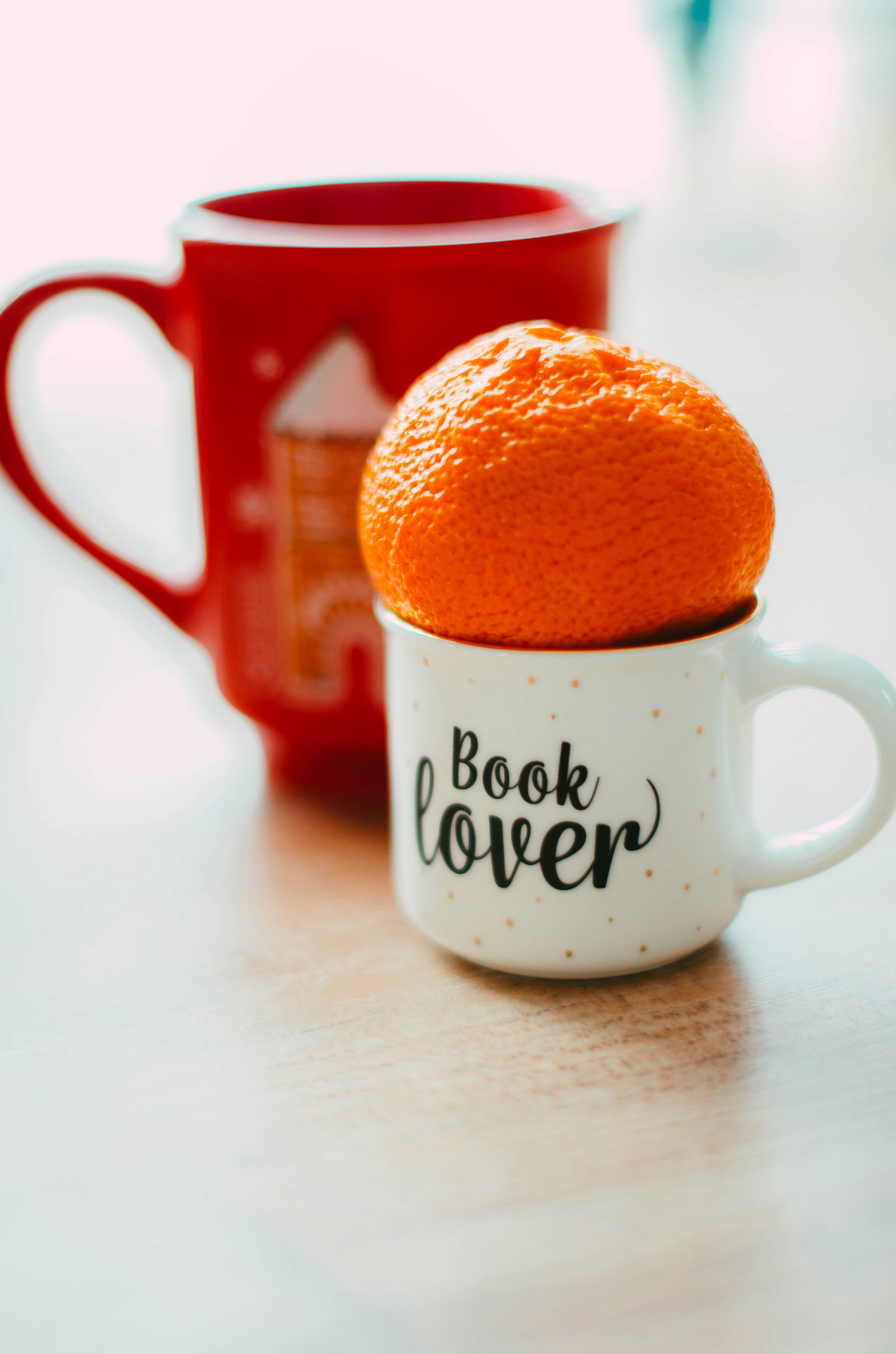 Orange Crown on a Mini Mug: A Quiet Morning of Coffee and Literature