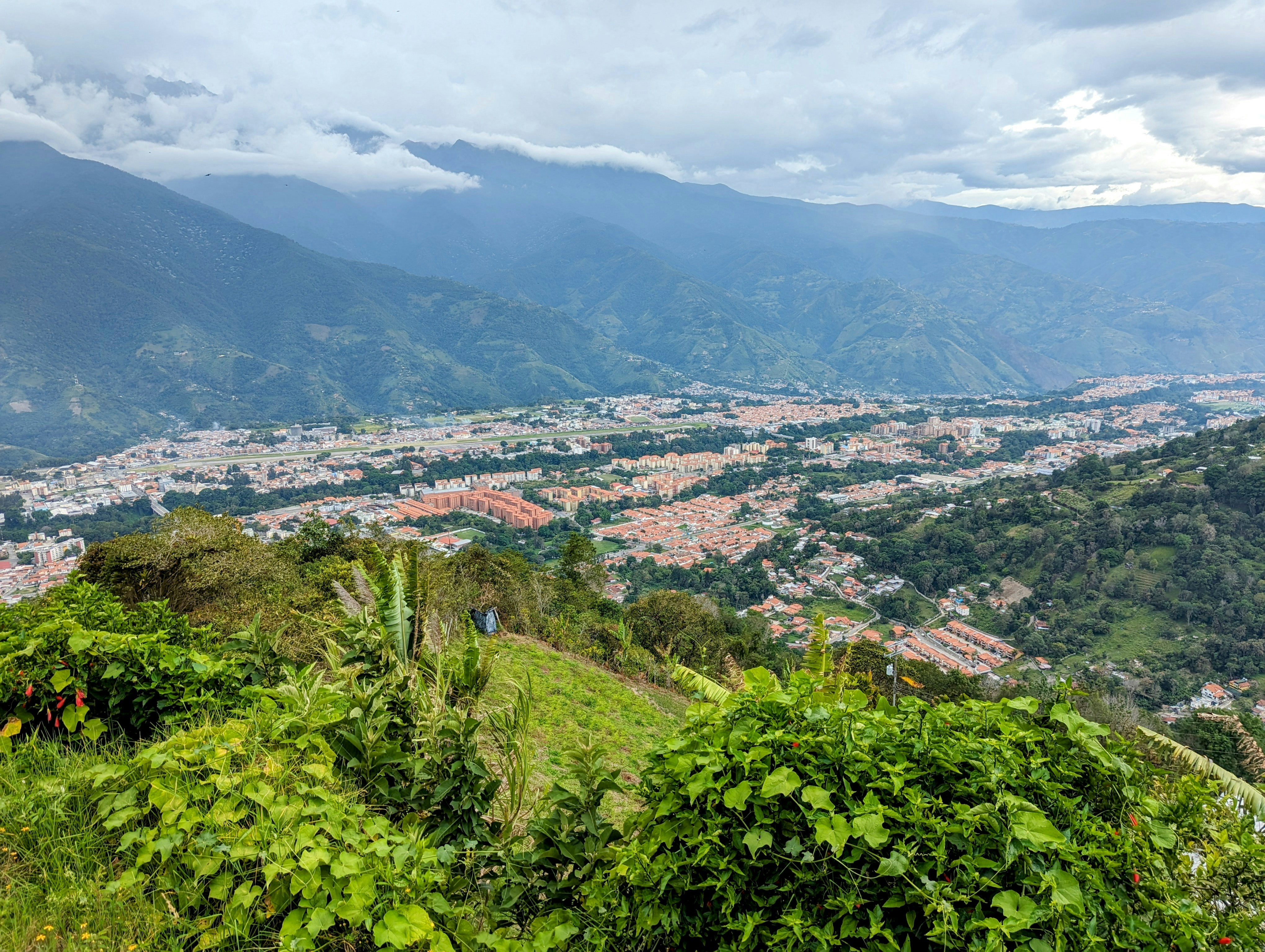Mérida, Venezuela | a view of a city from the top of a hill