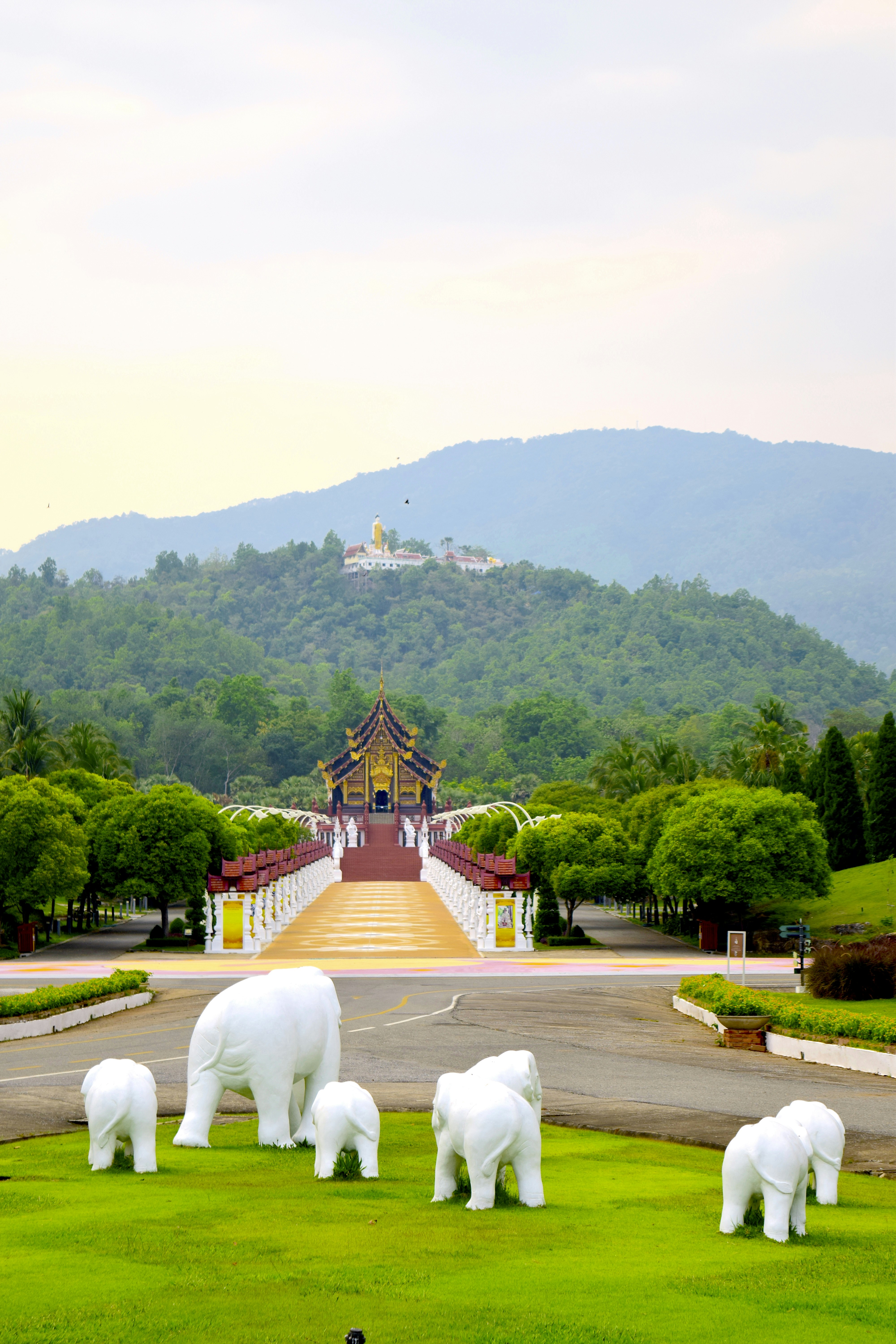 Symmetry at the Temple Gate: White Elephant Sculptures Framing a Hill Shrine