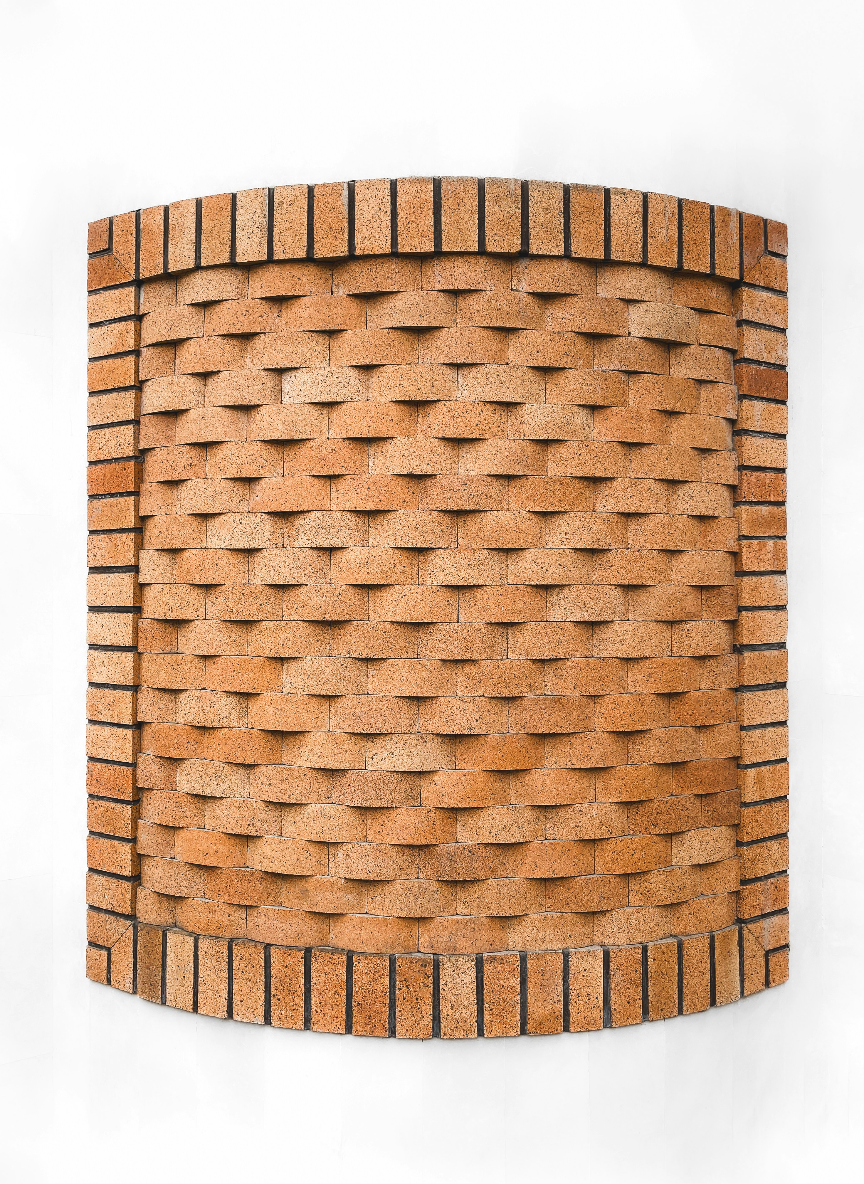 Curved Brick Weave: A Cylindrical Mosaic of Terracotta Texture