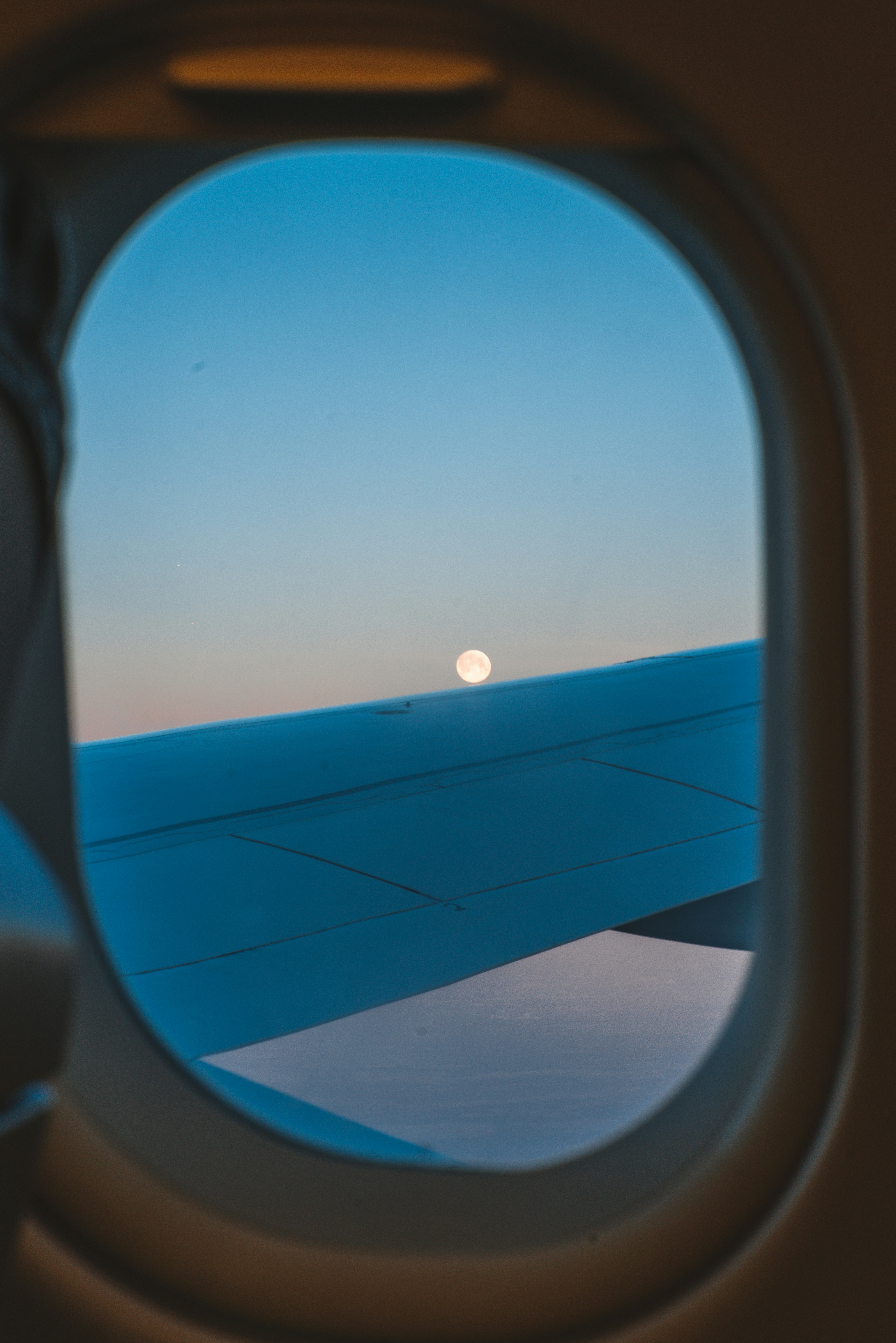 A view of the moon through an airplane window photo – Free Wing Image ...