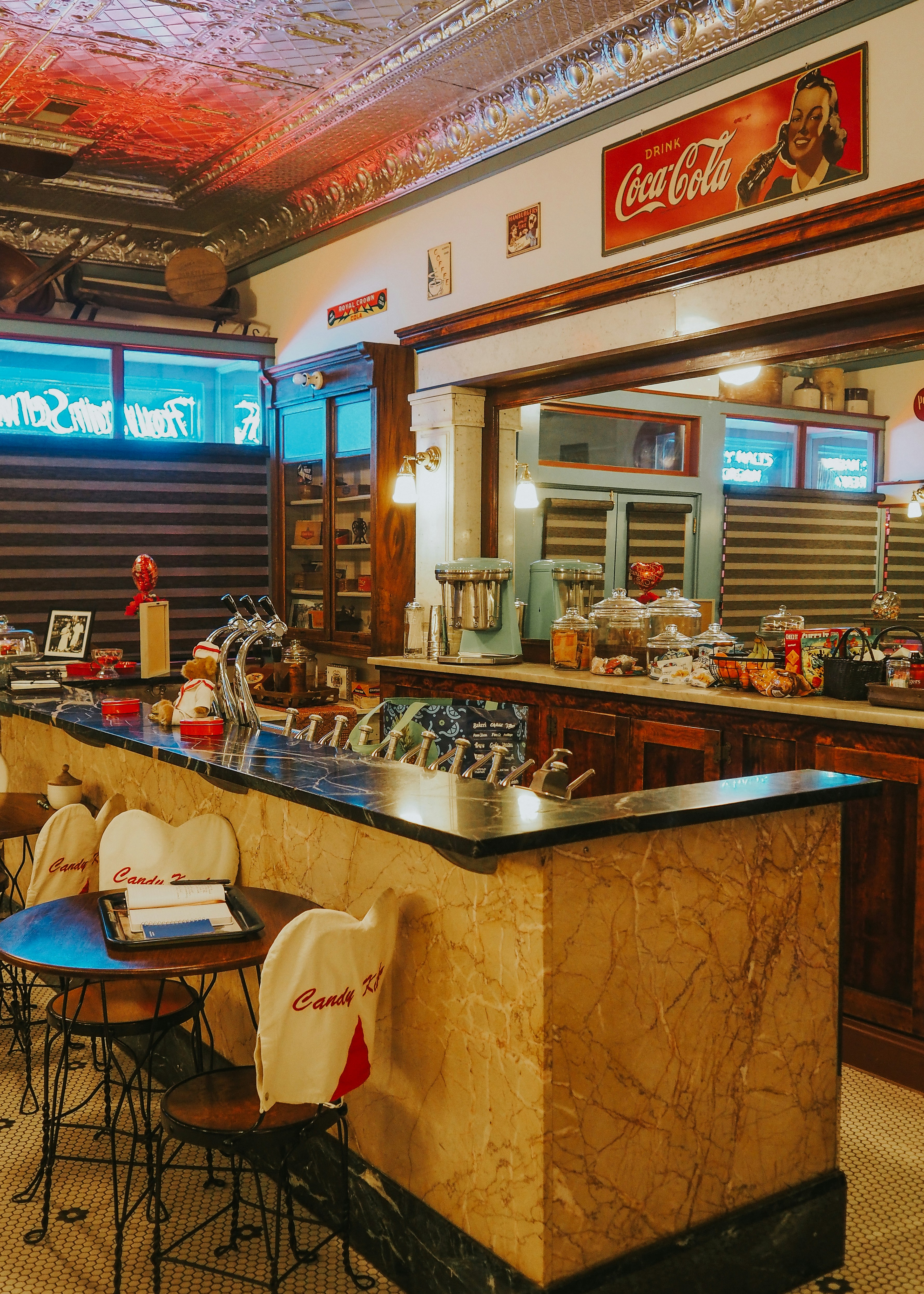 A restaurant with a long counter and chairs photo – Free Casey Image on ...