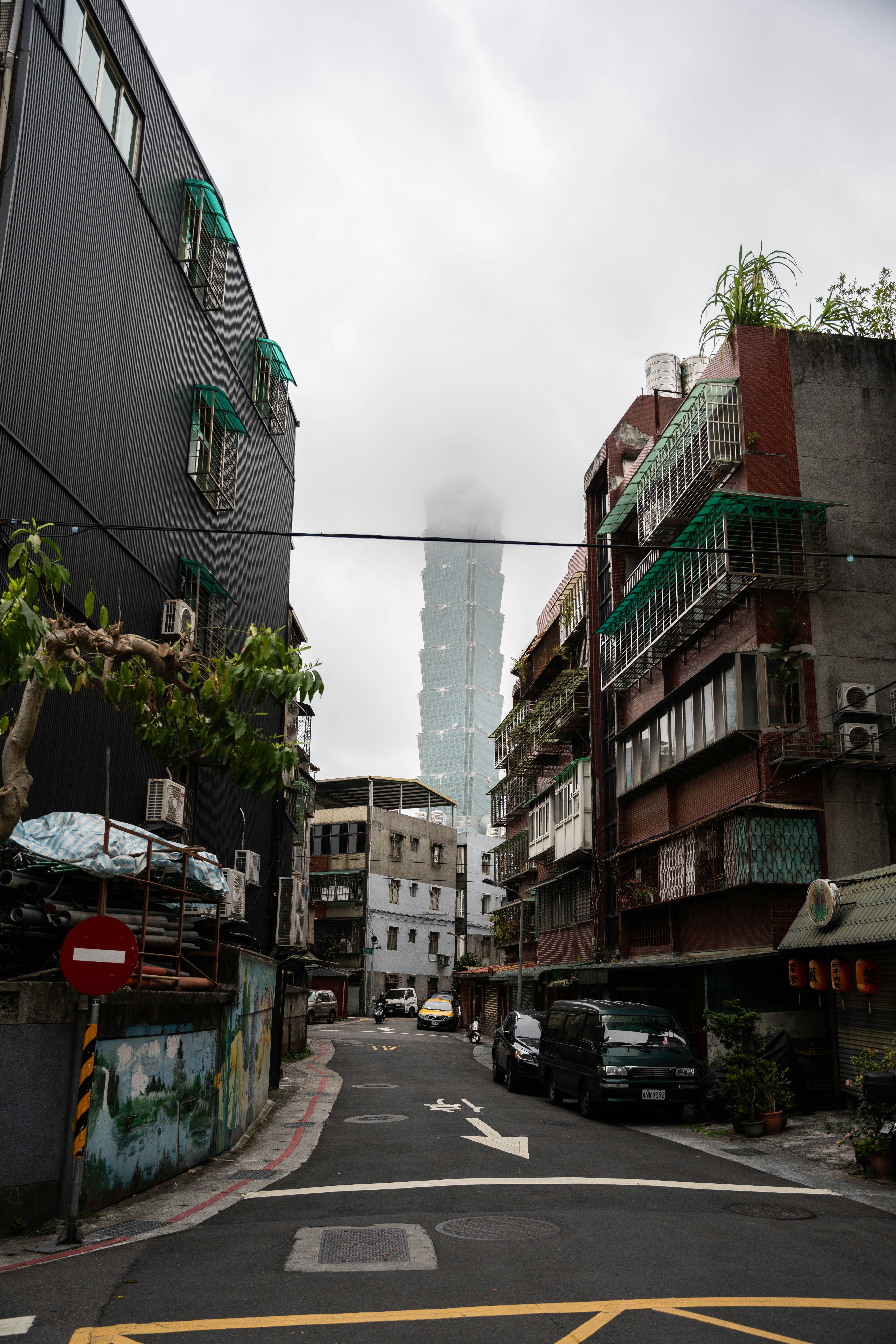 From Alley to Apex: Taipei 101 Framed by a Narrow Street
