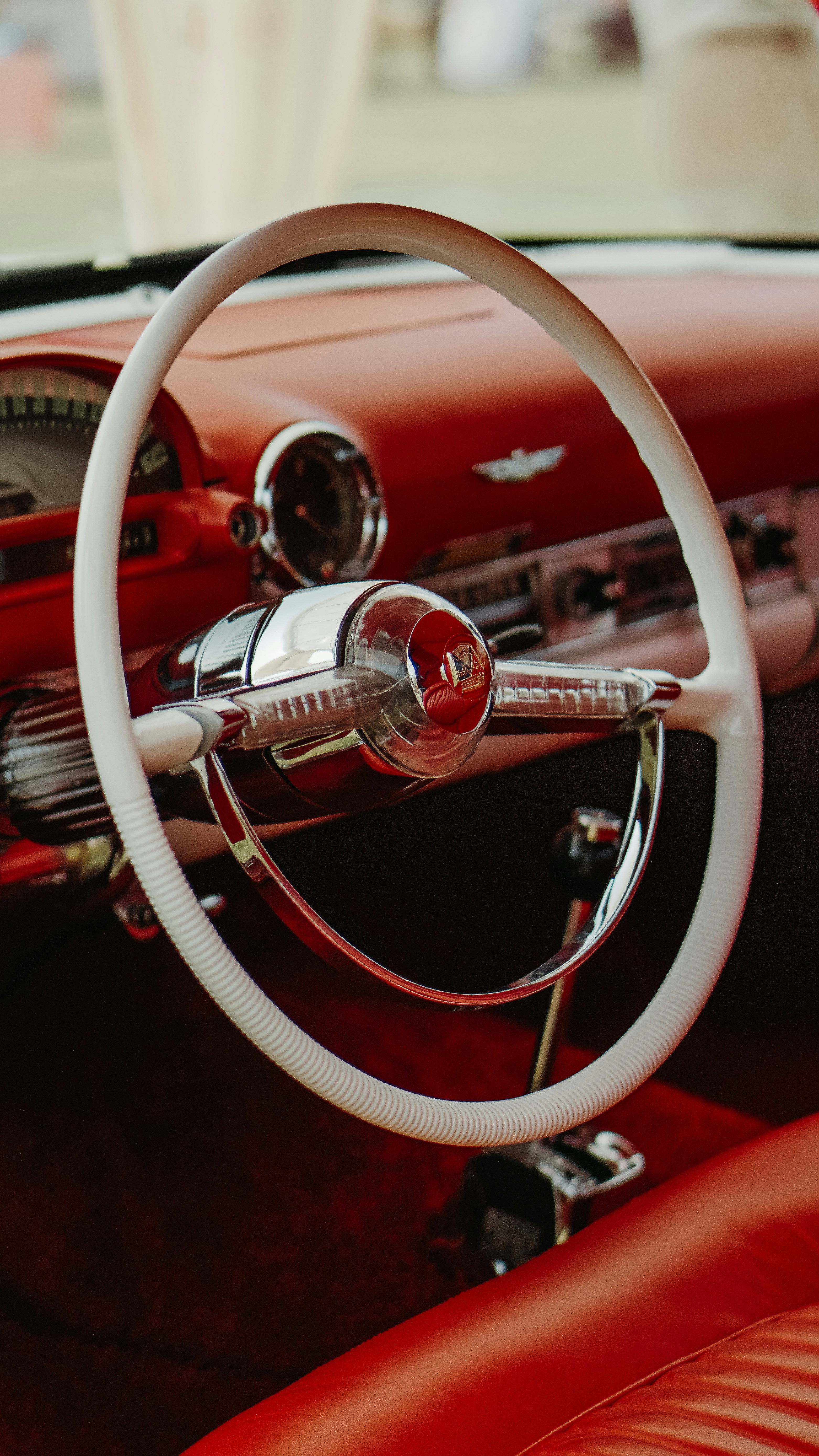 A steering wheel and dashboard of a classic car photo – Free Vintage ...