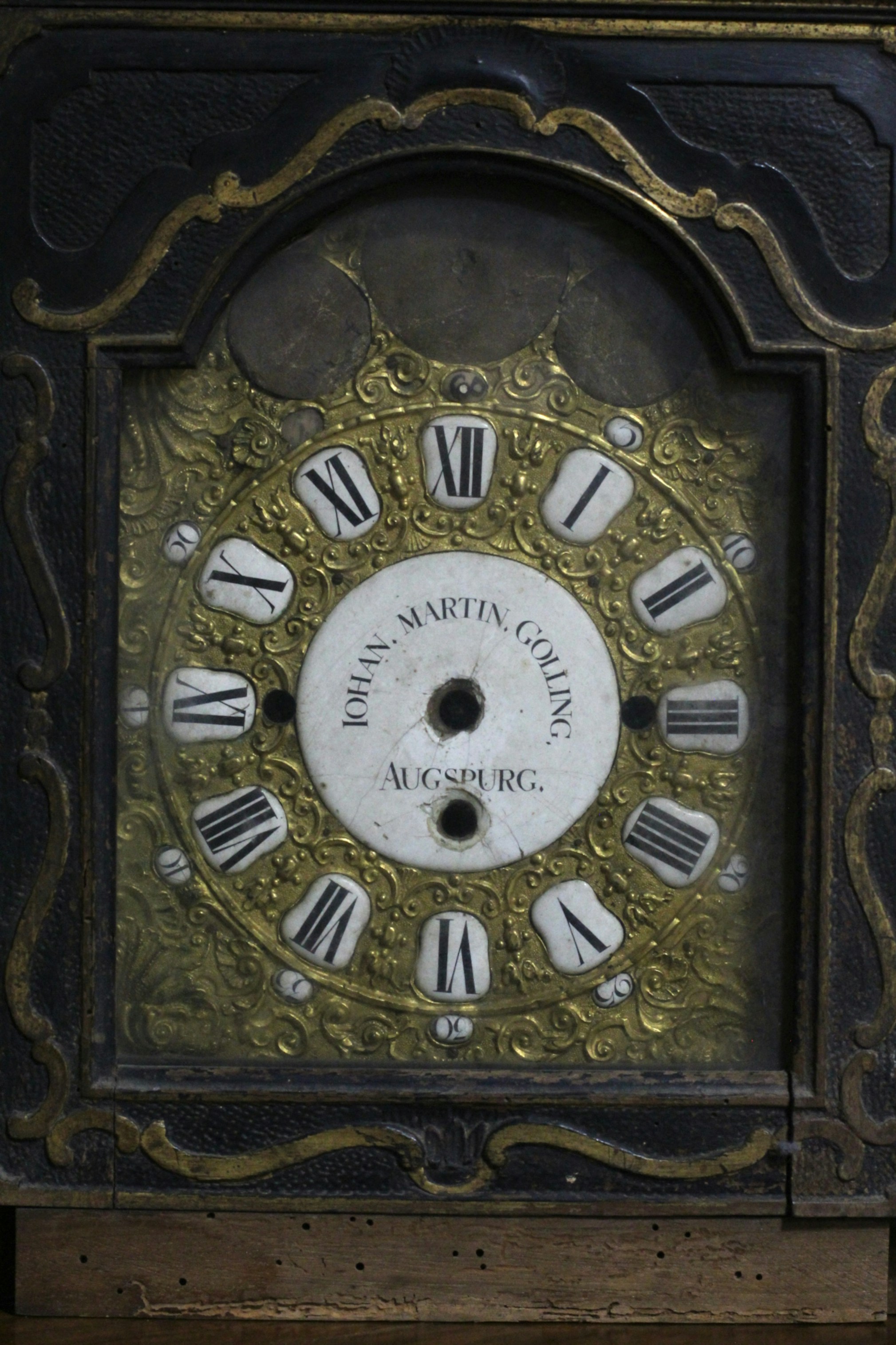 Ornate Brass Clock Dial in a Weathered Carved Wood Case