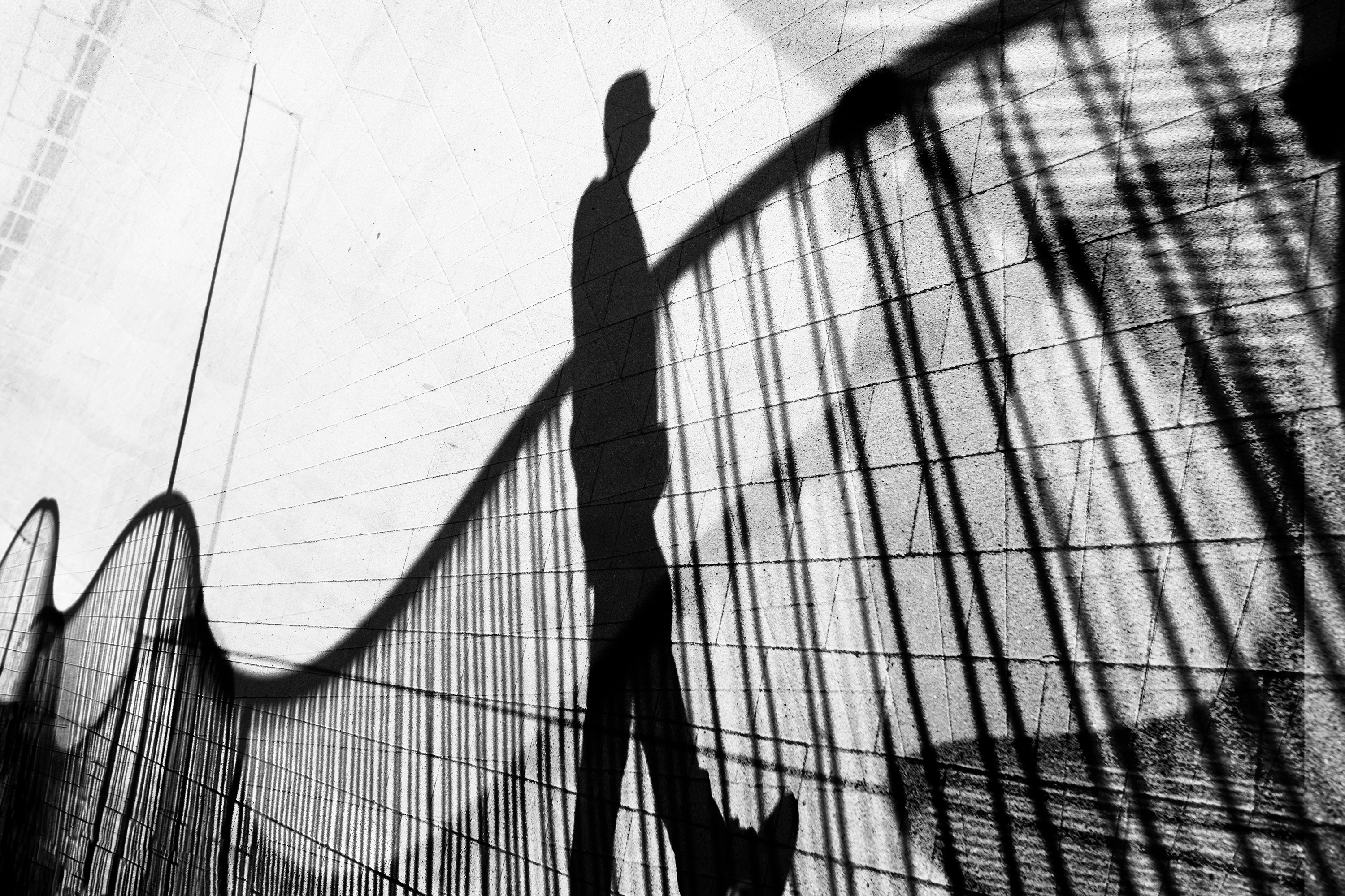 A shadow of a man walking across a bridge photo – Free Нижний новгород ...
