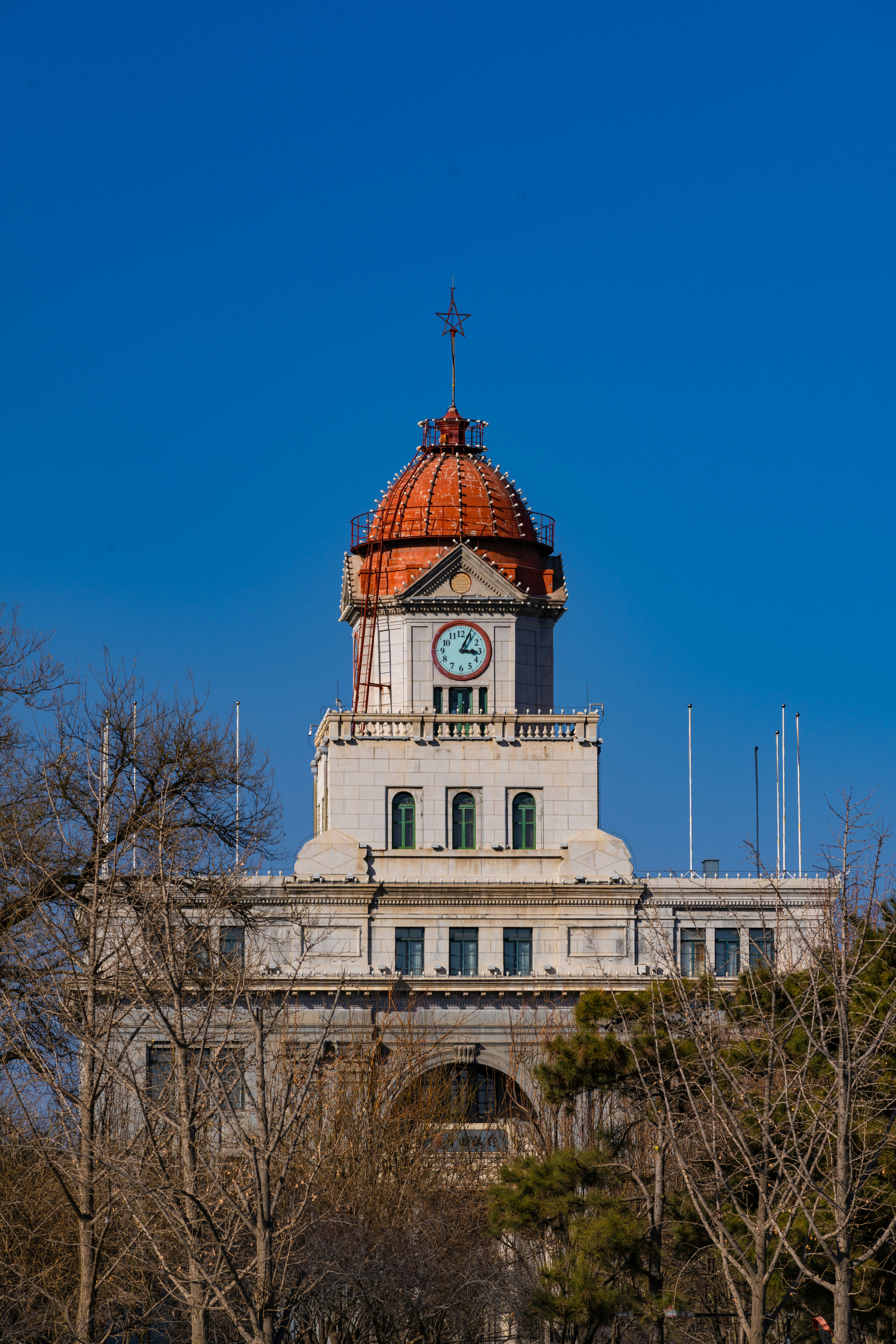 A large building with a clock on the top of it photo – Free Beijing ...