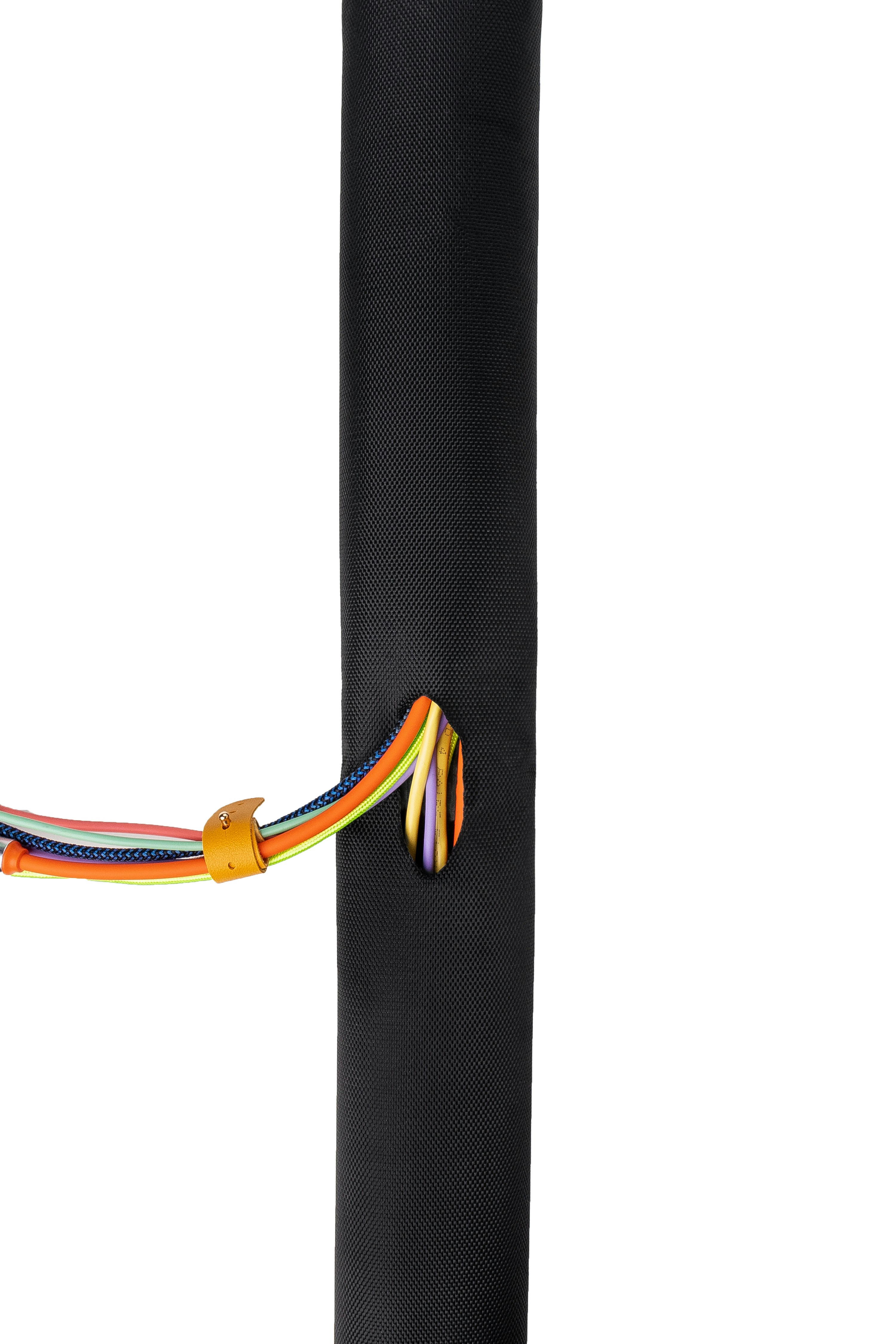 Woven Cable Exit Through a Black Tube: A Minimalist Macro Detail