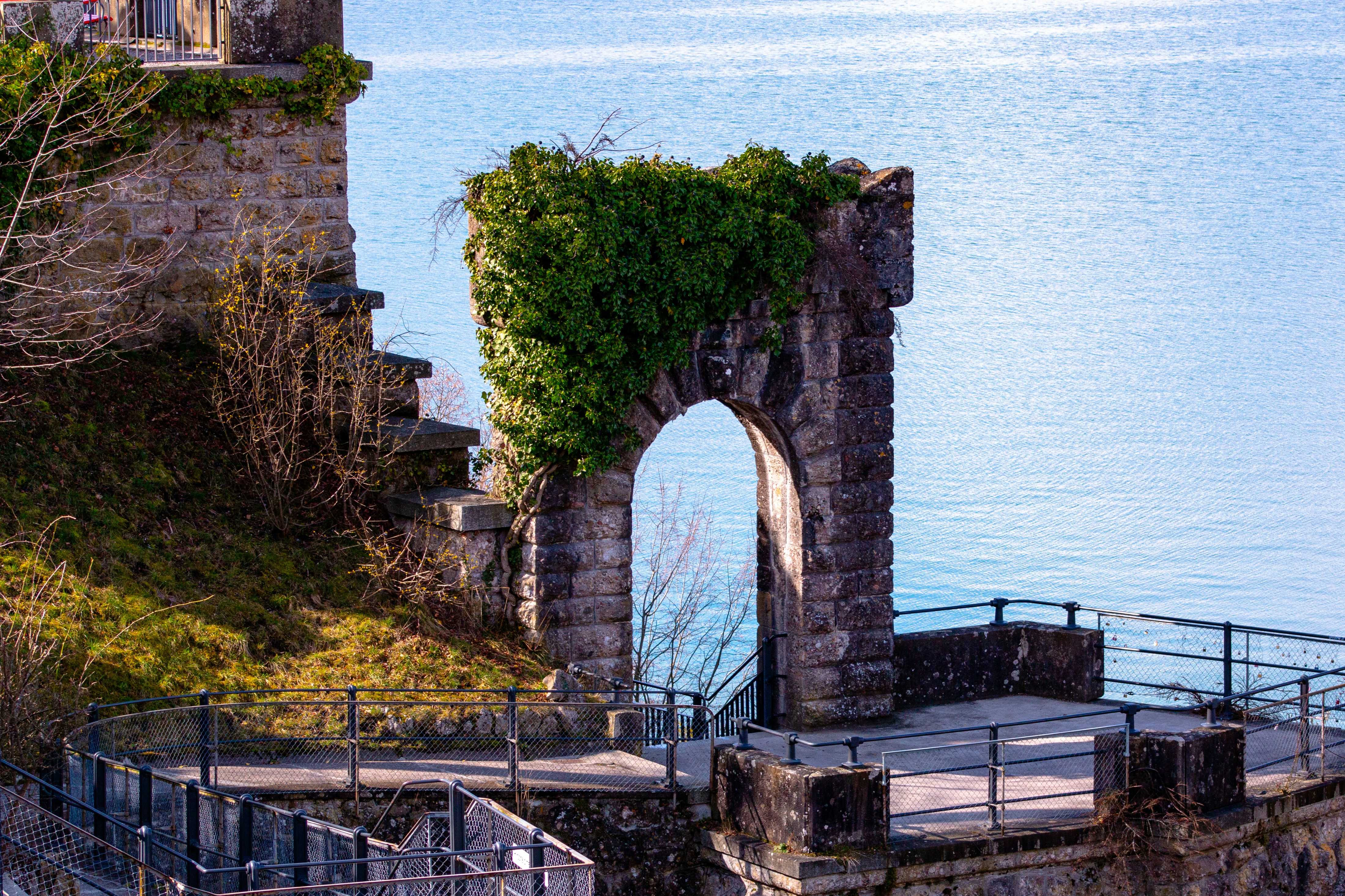 Stone Archway by the Quiet Lake