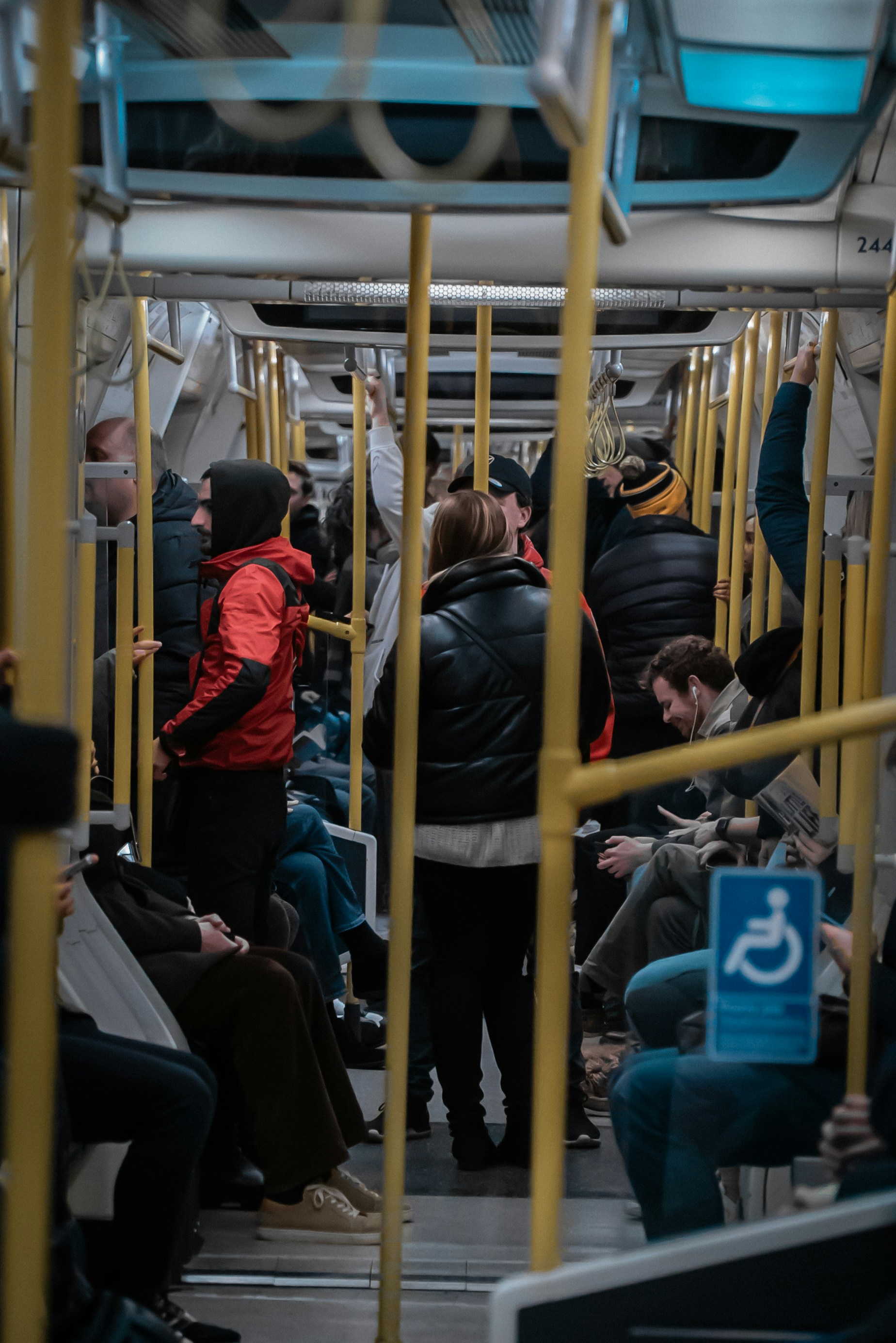 a group of people sitting on a subway train
