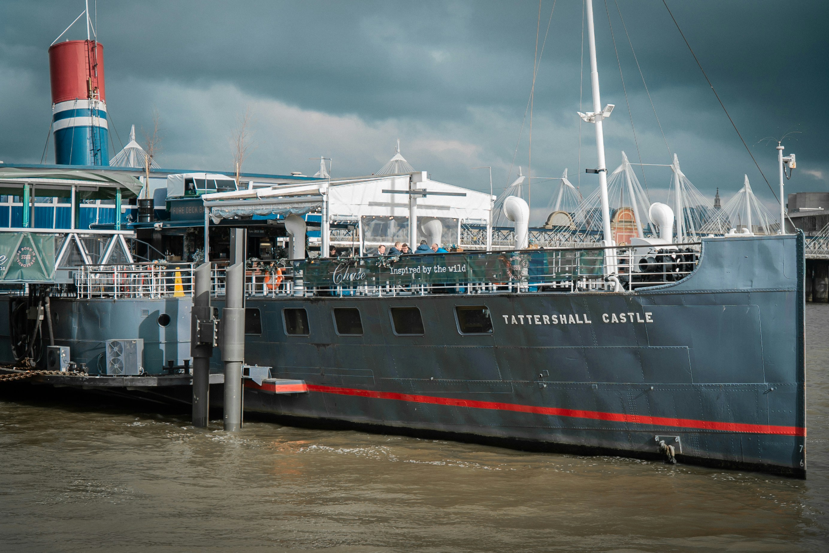 Tattersall Castle at the Dock: A Riverfront Vessel Framed by Modern Harbor Architecture