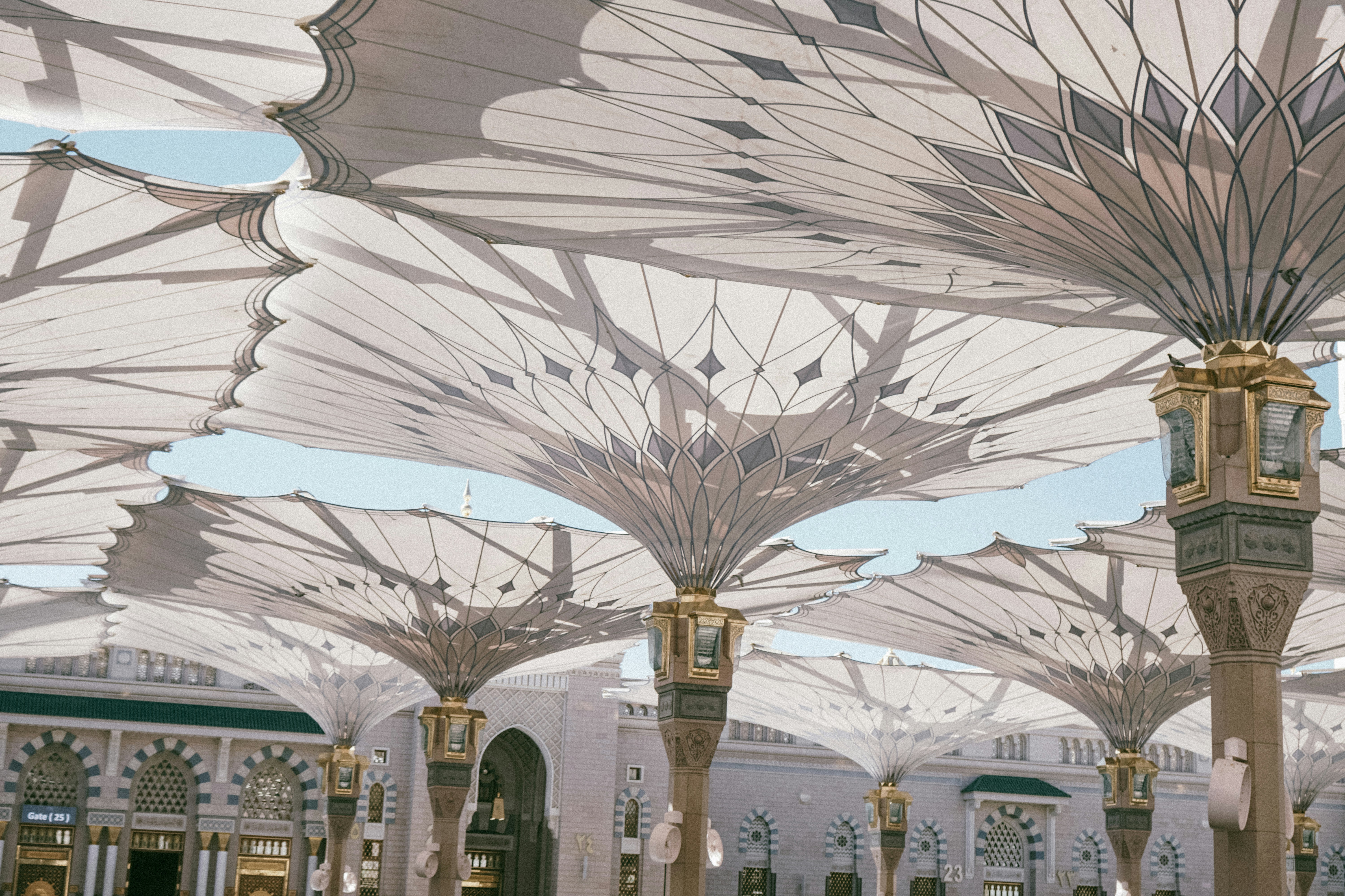 A bunch of umbrellas that are inside of a building photo – Free Grey ...