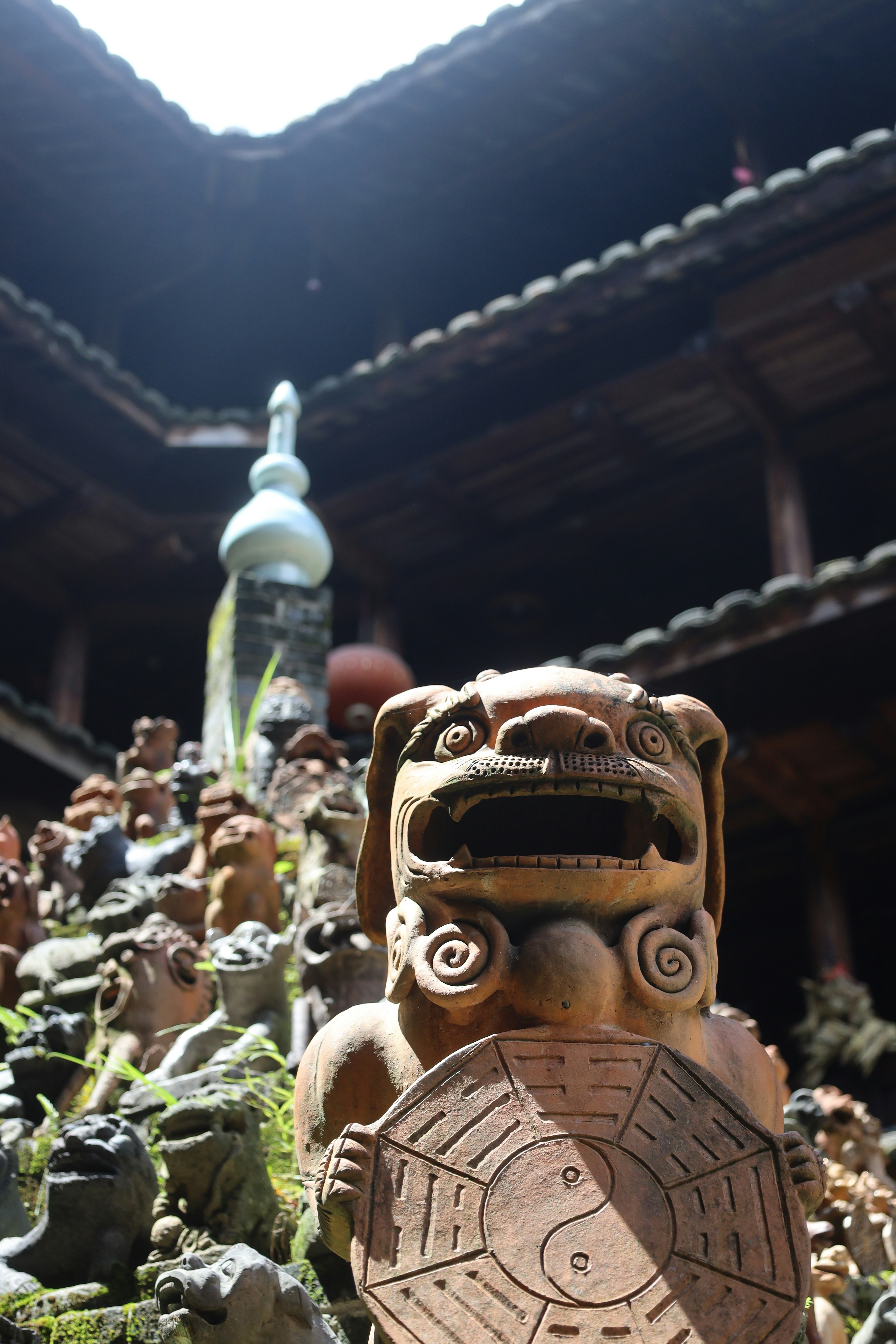 Stone Sentinel Amid a Sea of Guardians in a Temple Courtyard