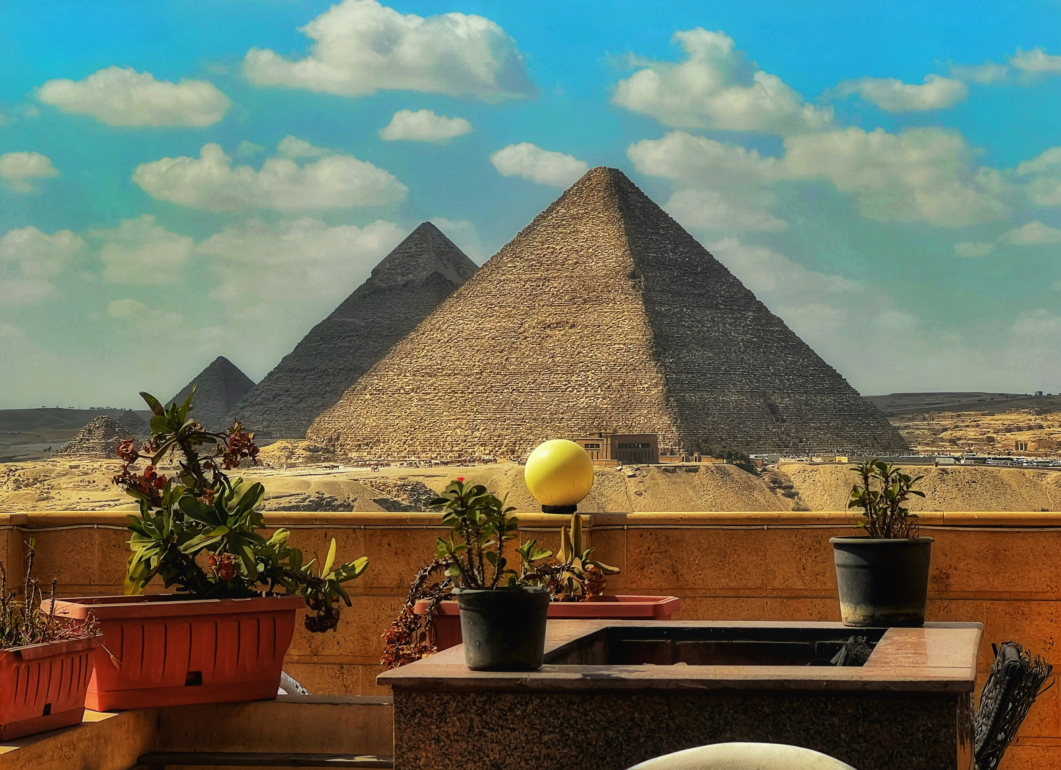 A view of the pyramids of giza from a balcony photo – Free Great ...