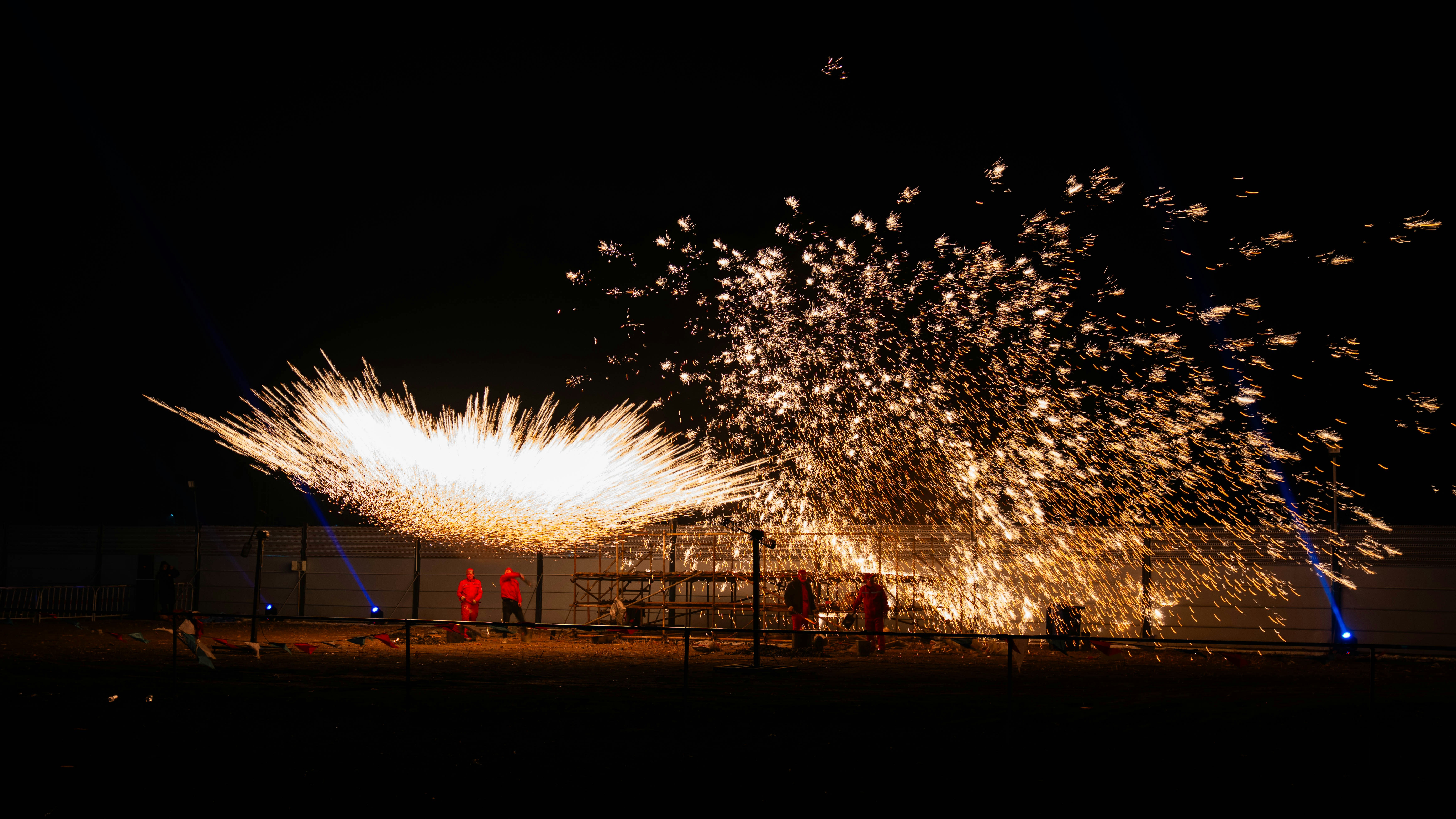 A firework display is lit up at night photo – Free Show Image on Unsplash