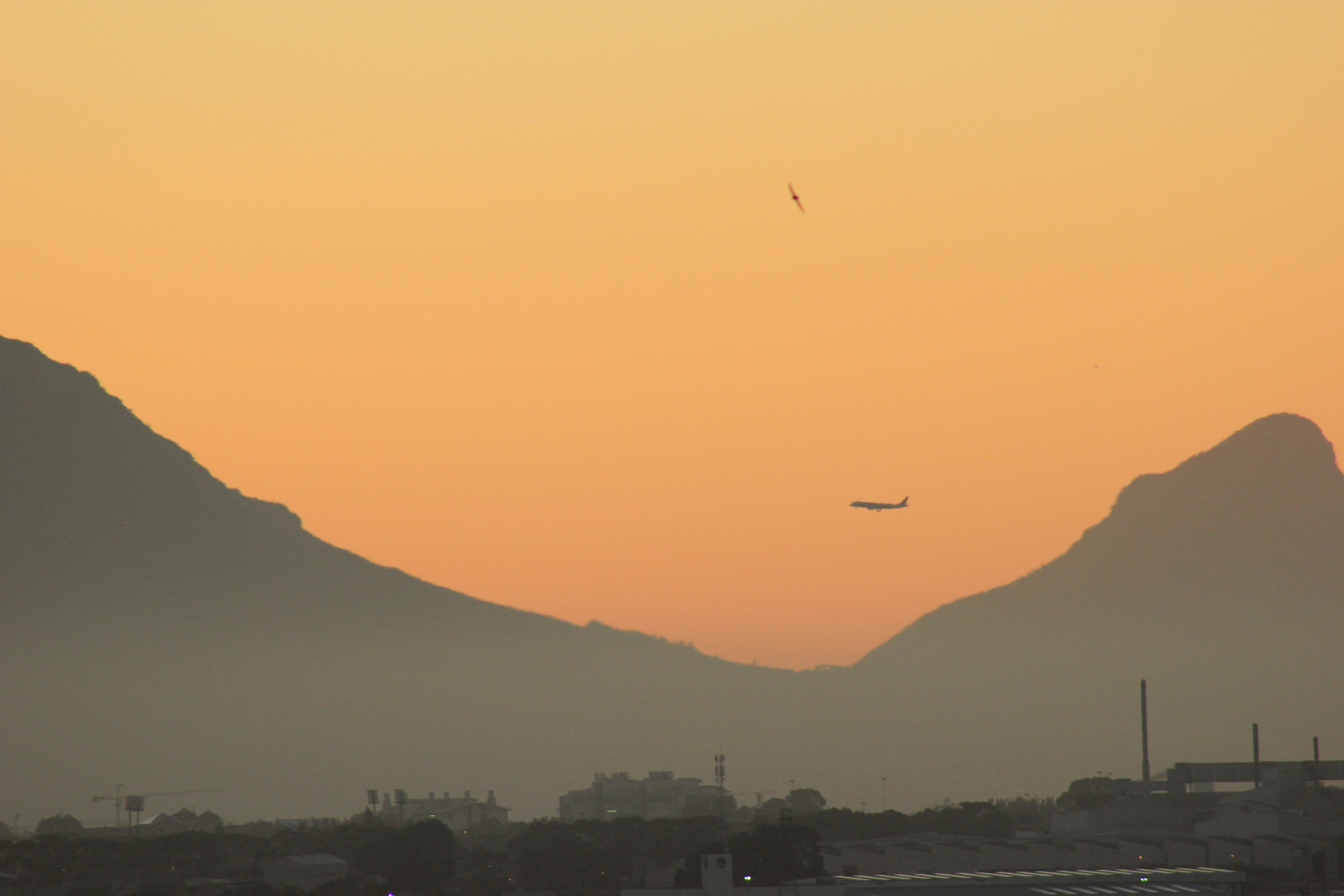 Peach Sunset Over the Ridge: A Quiet City Silhouette